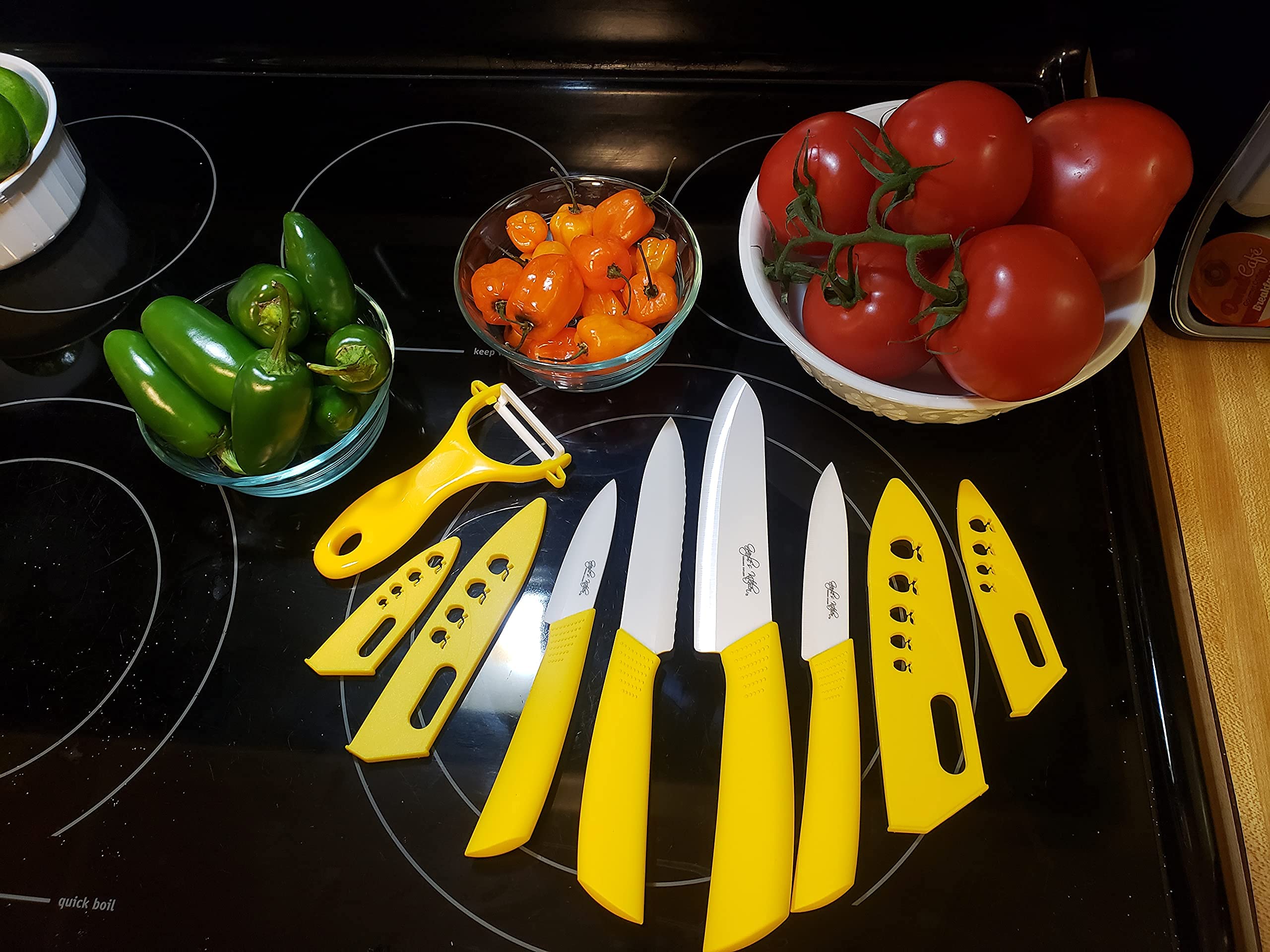 Serrated Black Ceramic Knife Set with 5" Serrated Knife. Includes 3”, 4”, 5”, 6” Ceramic Knives, Matching Sheaths and a Matching Vegetable Peeler in a Black Gift Box