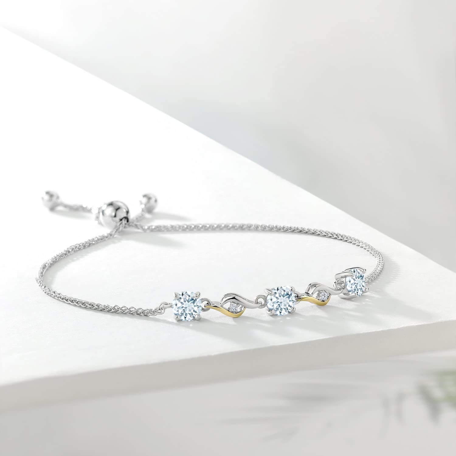 Gem Stone King 925 Silver and 10K Yellow Gold Bracelet For Women Round Sky Blue Aquamarine and Moissanite (1.52 Cttw)