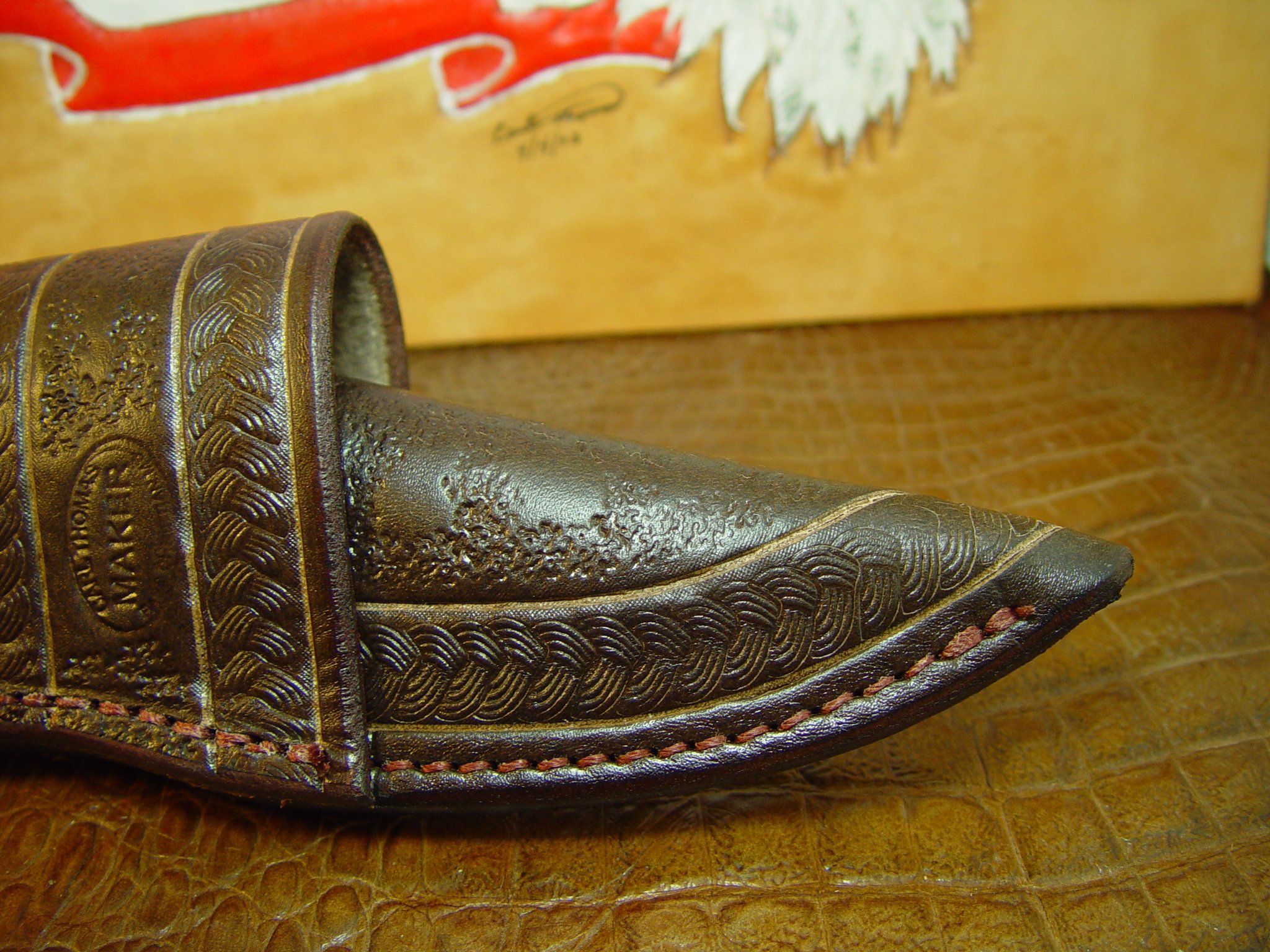 New Buck Vanguard Cross Draw Knife Sheath. Made of 10 Oz Water Buffalo Leather and Has a Rope Pattern Tooling with Random Patterning in the Center of the Sheath. Sheath ONLY!