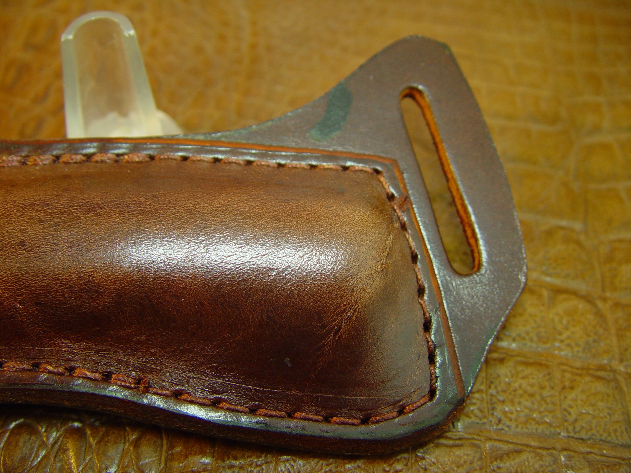 Custom Right-hand Cross Draw Trapper Style Folding Knife Sheath. Made Out of 10 Ounce Buffalo Hide Leather. Dyed Light Brown Sheath Only Knife Not Included.