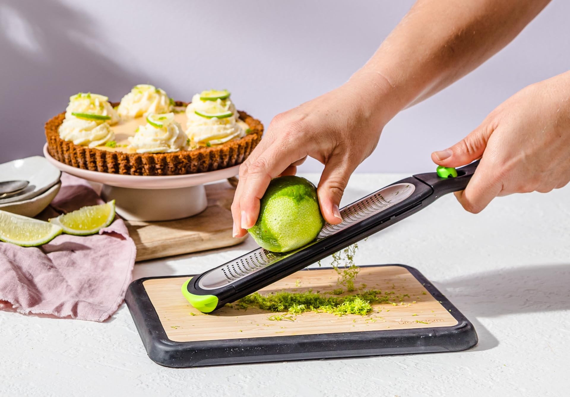 Dreamfarm Ozest Self-Cleaning POP-Button Zester for Fine, Fluffy Citrus Zest, Cheese, Nut, & Spices with Non-Slip Silicone Foot - 1mm Zester, Black/Green