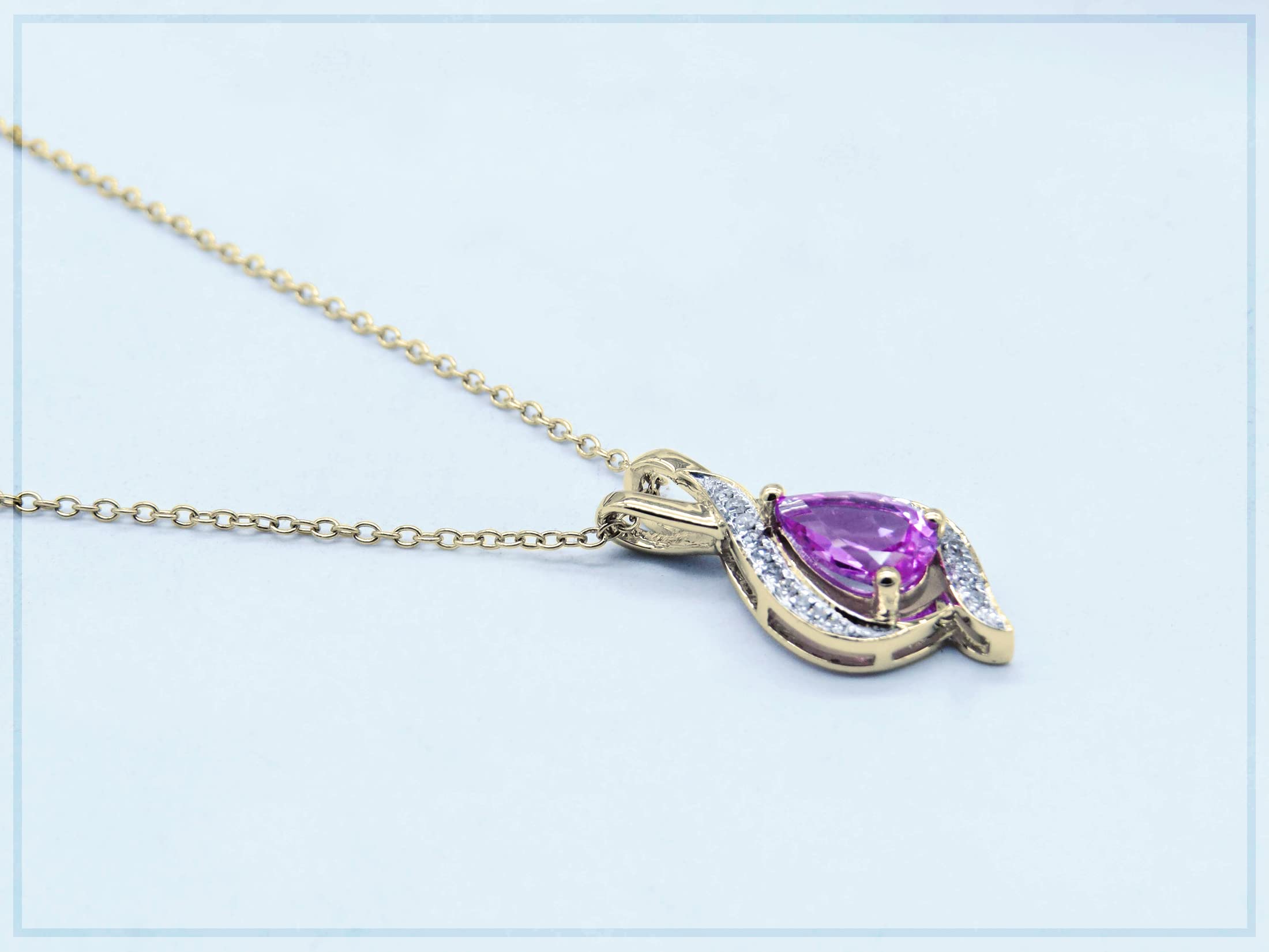 Dazzlingrock Collection 9x6 mm Pear Lab Created Pink Sapphire & Round White Diamond Swirl Teardrop Pendant with 18 inch Gold Chain for Women in 10K Yellow Gold