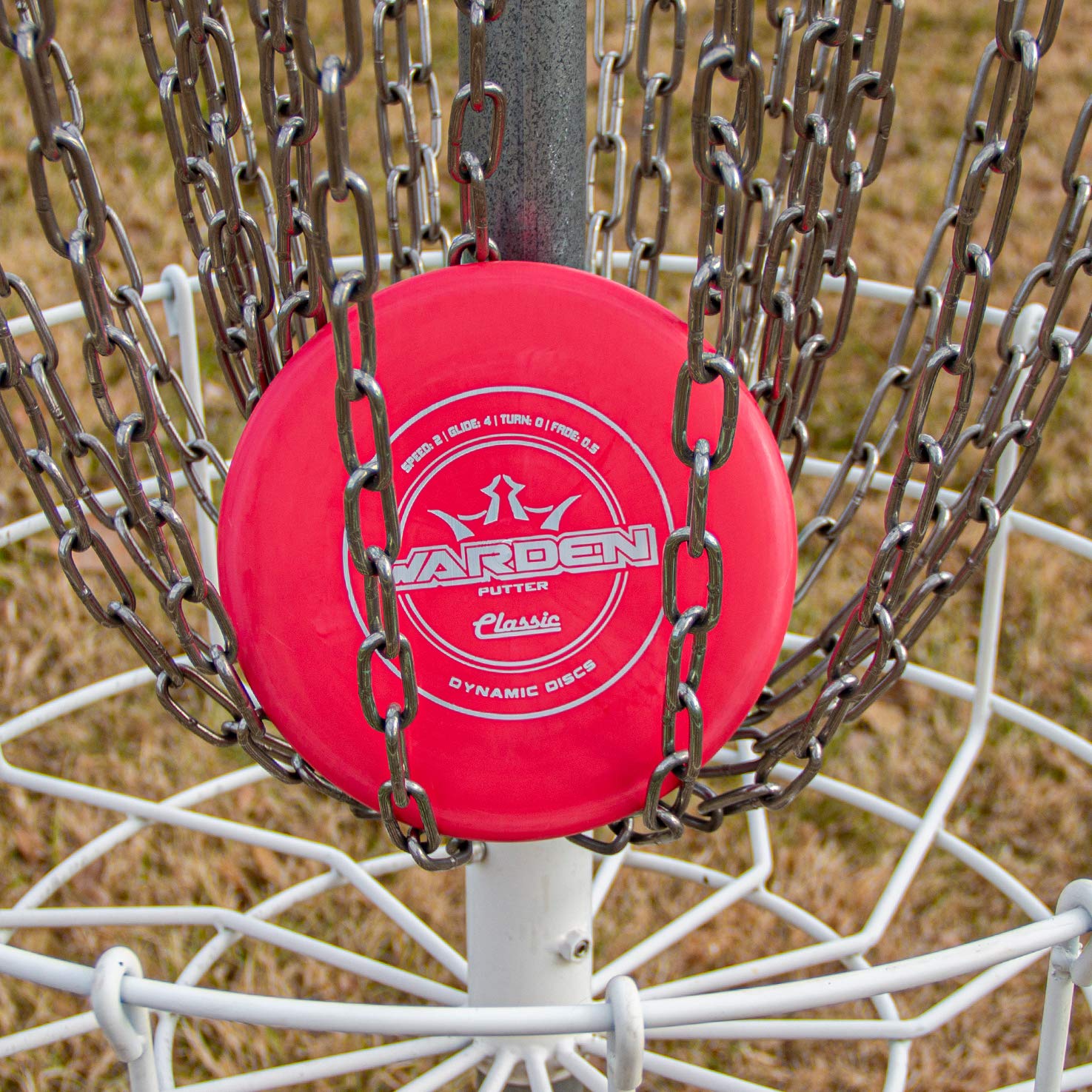 Dynamic Discs Classic Warden Disc Golf Putter | 170g Plus | Throwing Frisbee Golf Putter | Smooth Release and Neutral Flight | Straight Flying Disc Golf Putter | Stamp Color Will Vary (Red)