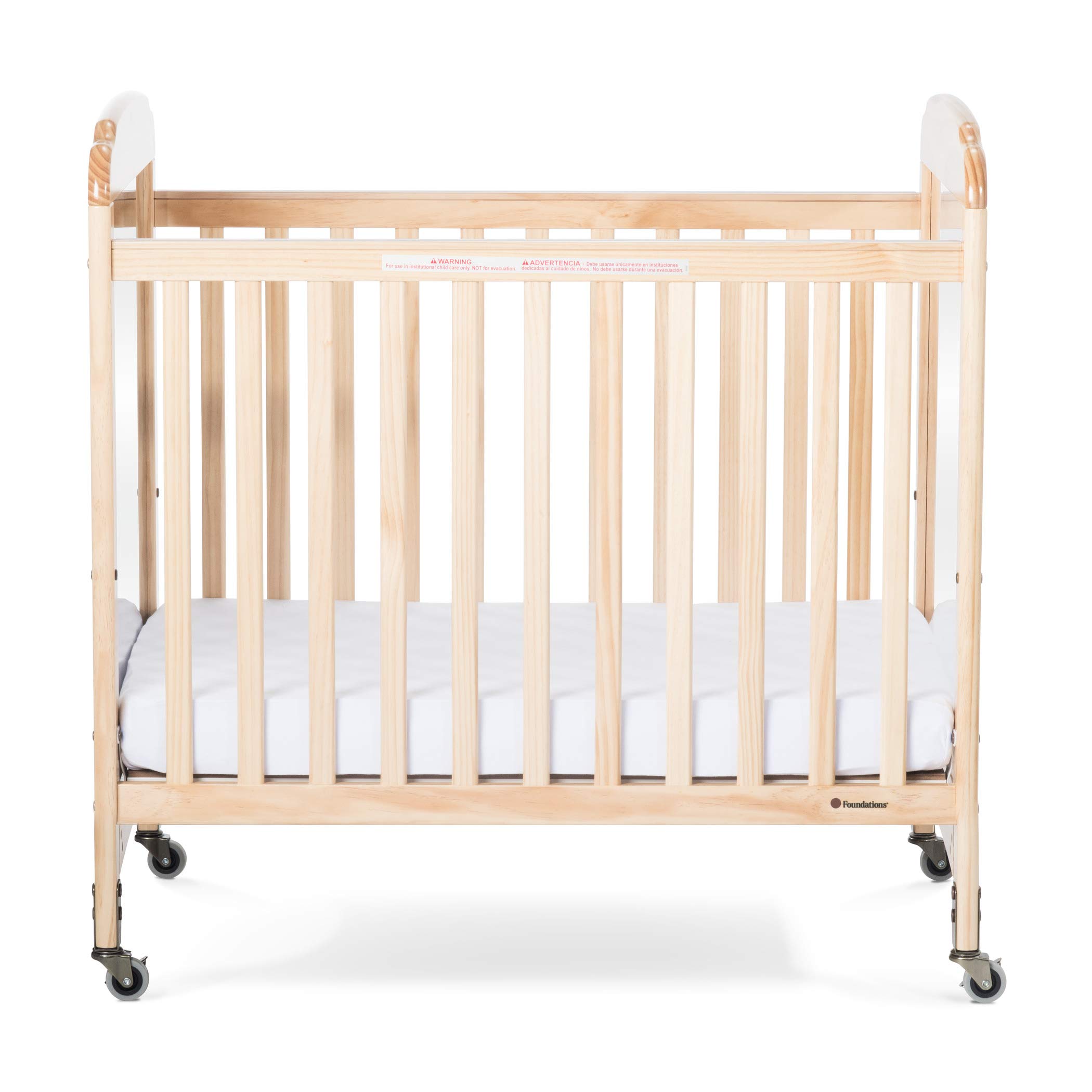 Foundations Serenity Compact Daycare Crib, Fixed Side, Features Mirrorview End Panels and Slatted Side Panels, Durable Wood Construction, Includes 3β InfaPure Foam Mattress (Natural)