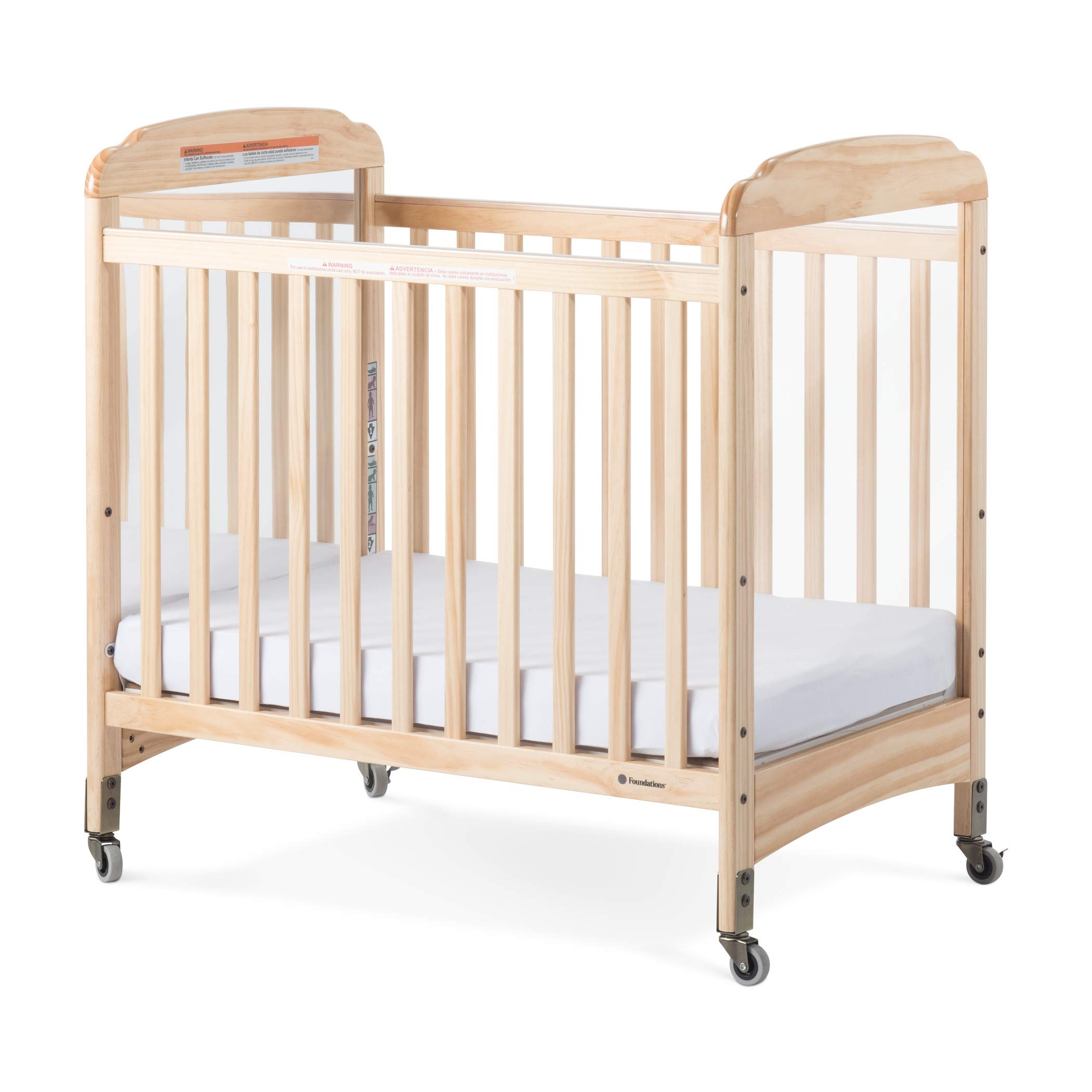 Foundations Serenity Compact Daycare Crib, Fixed Side, Features Mirrorview End Panels and Slatted Side Panels, Durable Wood Construction, Includes 3β InfaPure Foam Mattress (Natural)