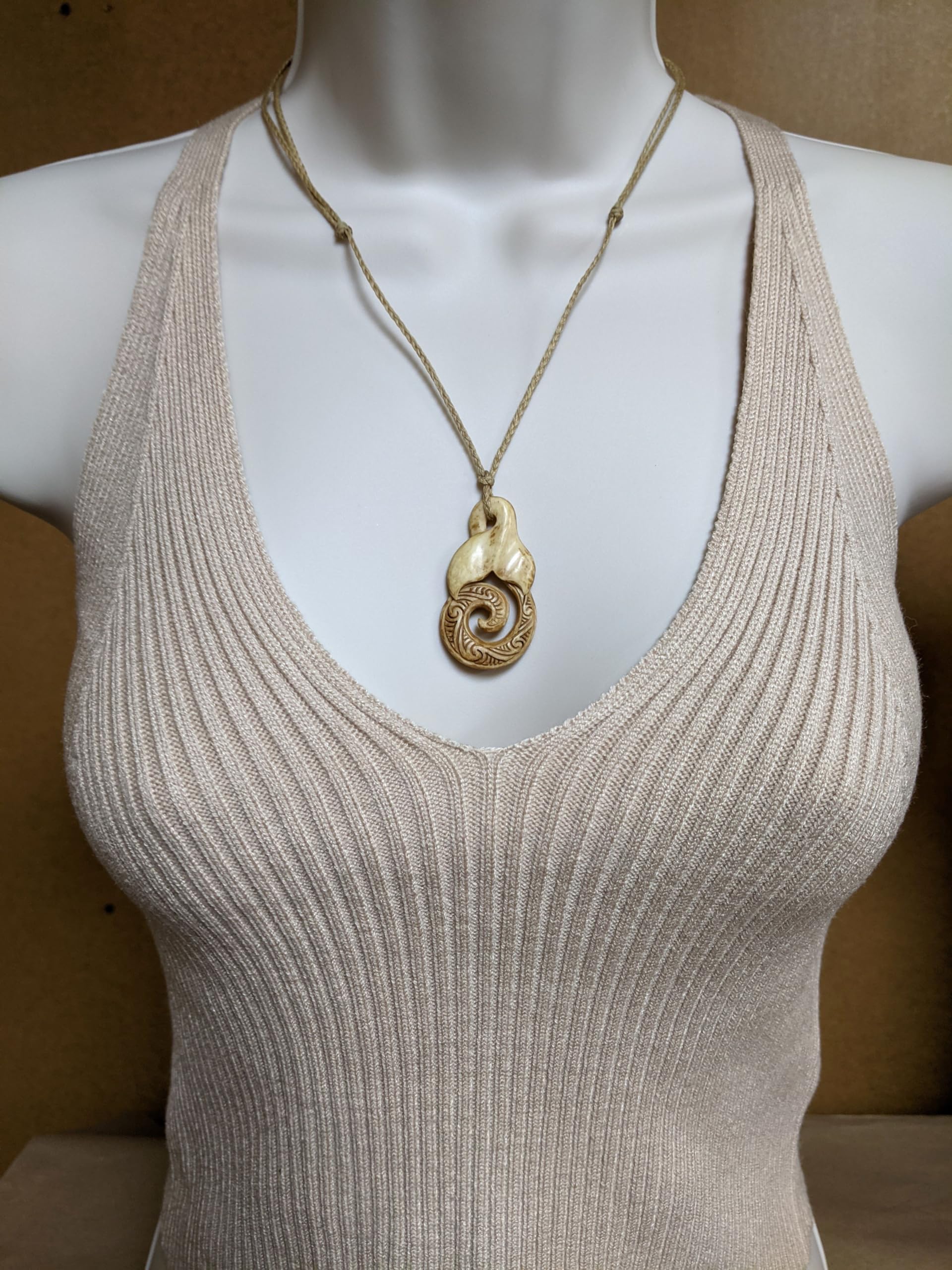 Earthbound Pacific Hand Carved Aged Bone Whale Tail Necklace with Infinity Loop and Spiral