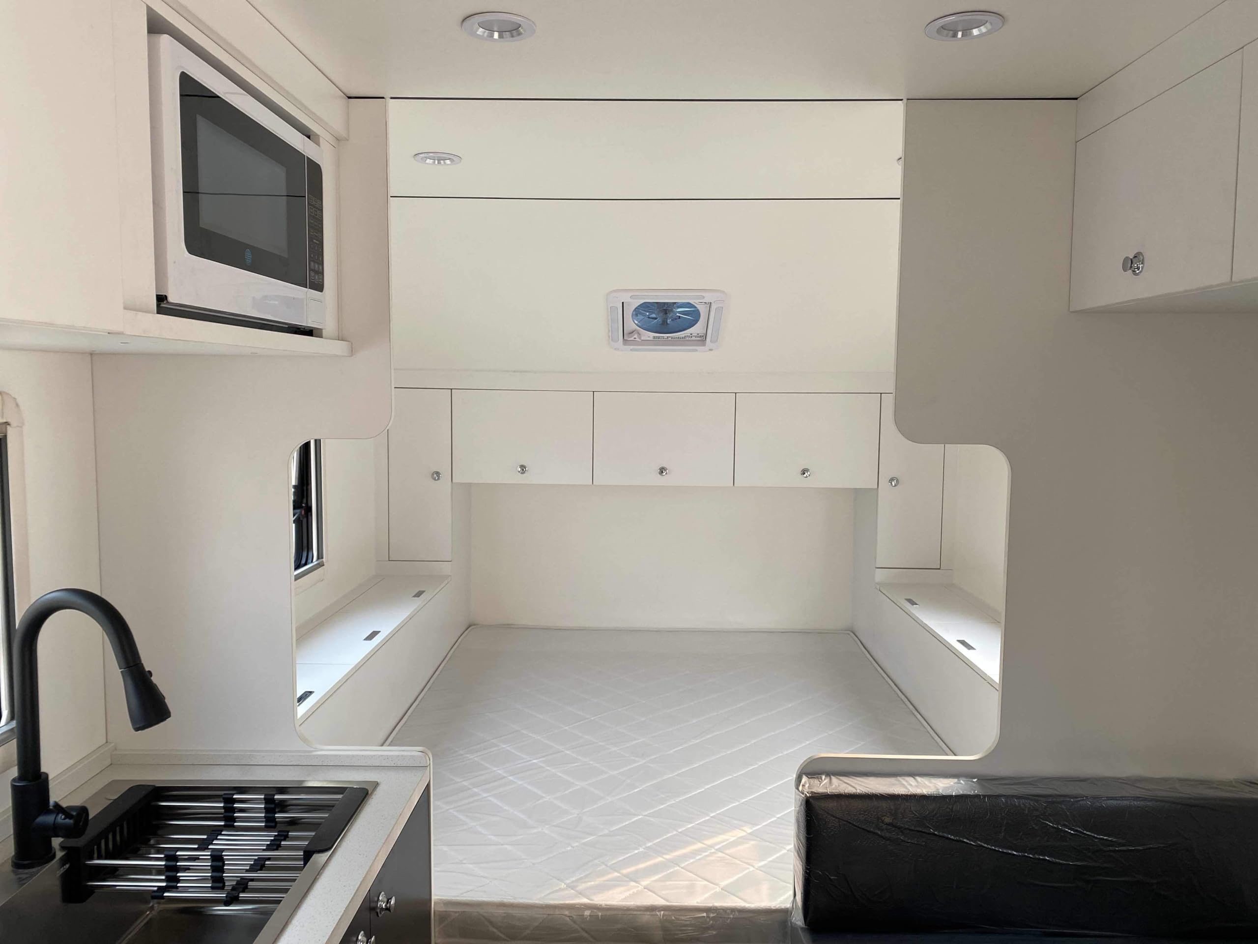 Offroad Caravans Trailer with Bedroom/Living Room/Bathroom and Kitchen.White and Black Color.