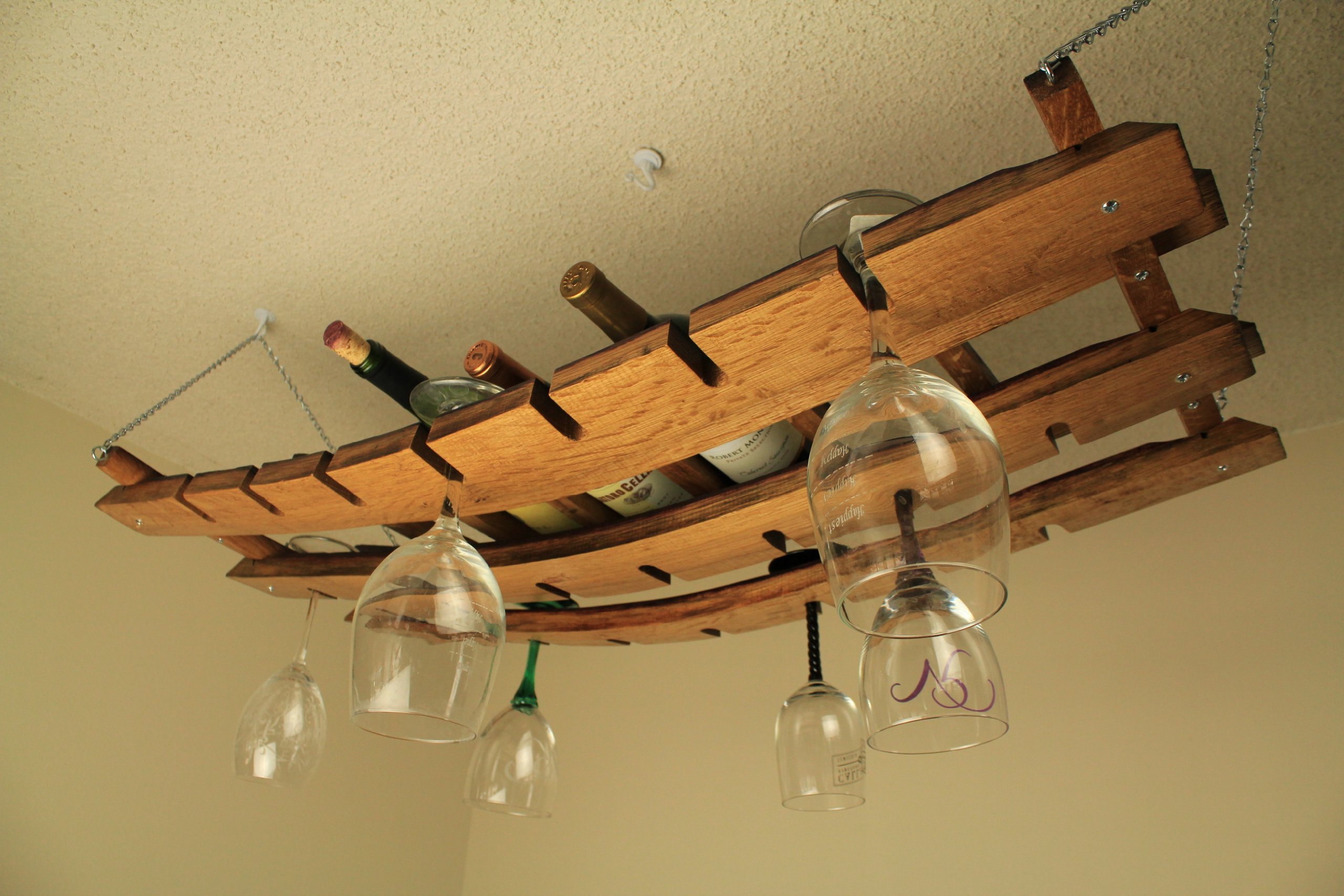 Hanging wine bottle and glass rack made from oak wine barrel staves