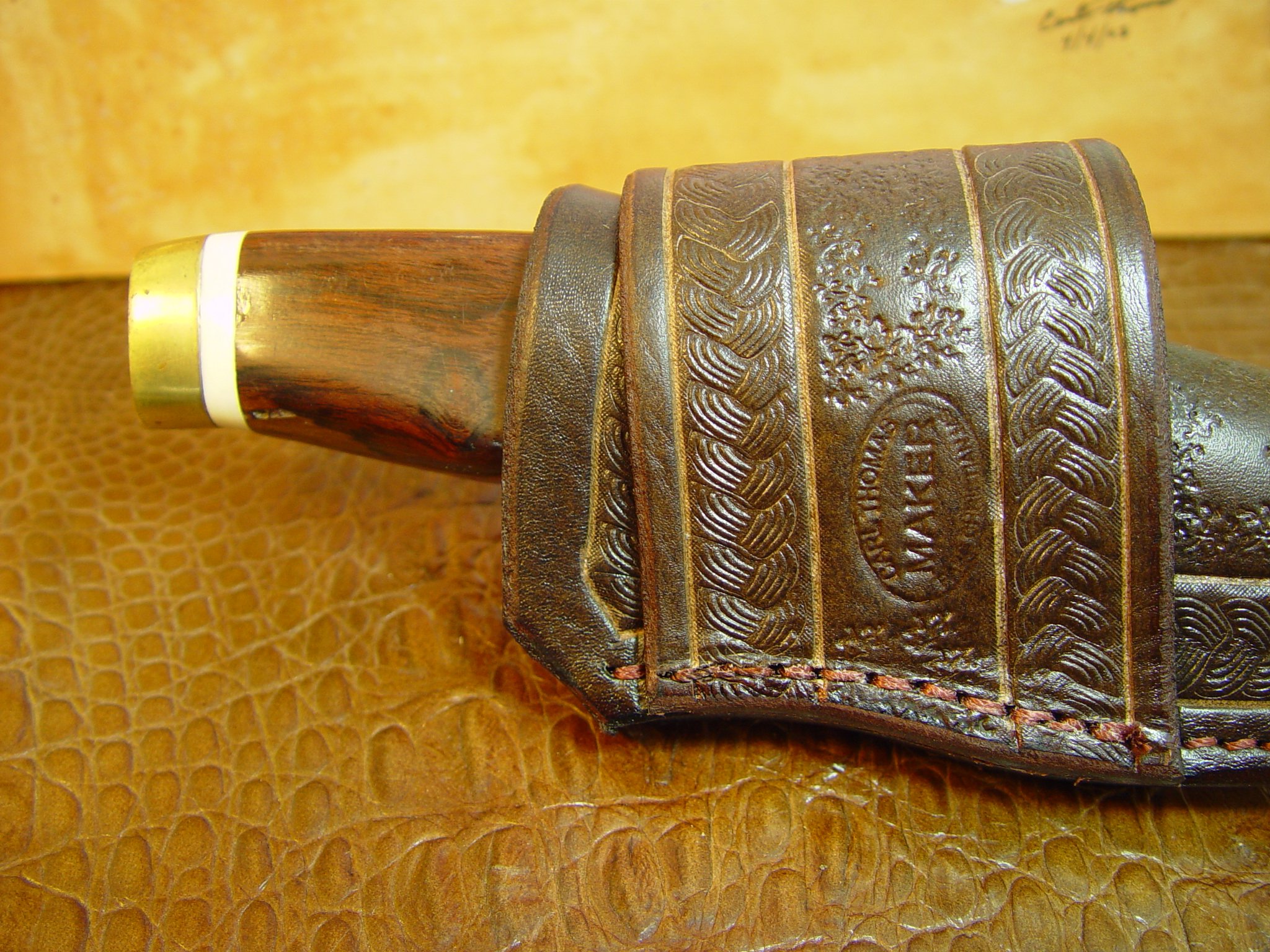 New Buck Vanguard Cross Draw Knife Sheath. Made of 10 Oz Water Buffalo Leather and Has a Rope Pattern Tooling with Random Patterning in the Center of the Sheath. Sheath ONLY!