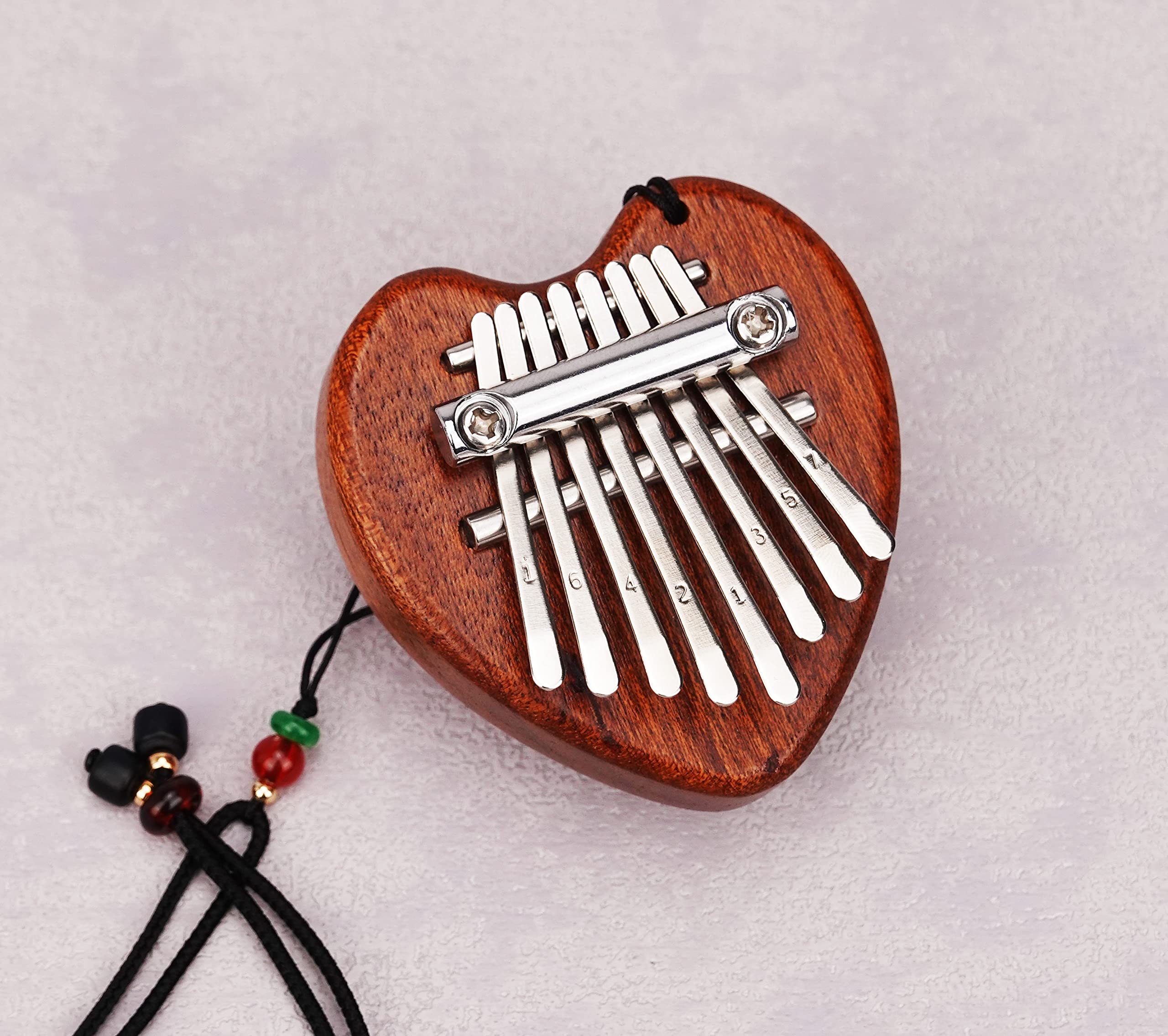 HKPLDE Mini Kalimba 8-key Thumb Piano Mbira Portable Finger Instrument Suitable for Music Beginners Adults or Kids (Water Drop with Lanyard)