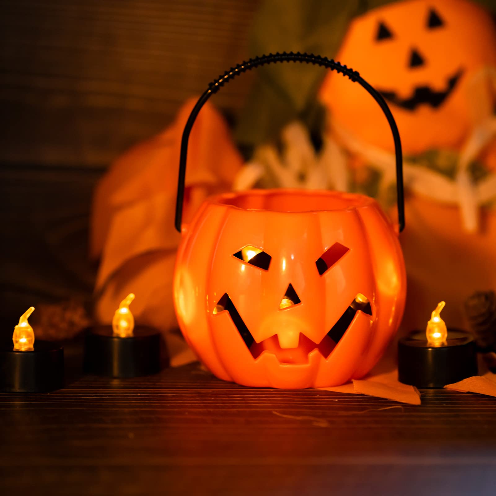 LANKER 24 Pack Black Tea Lights Candles β Flickering Warm Yellow Lights Flameless LED Candles β Long Lasting Battery Operated Fake Candles β Decoration for Wedding, Halloween and Christmas