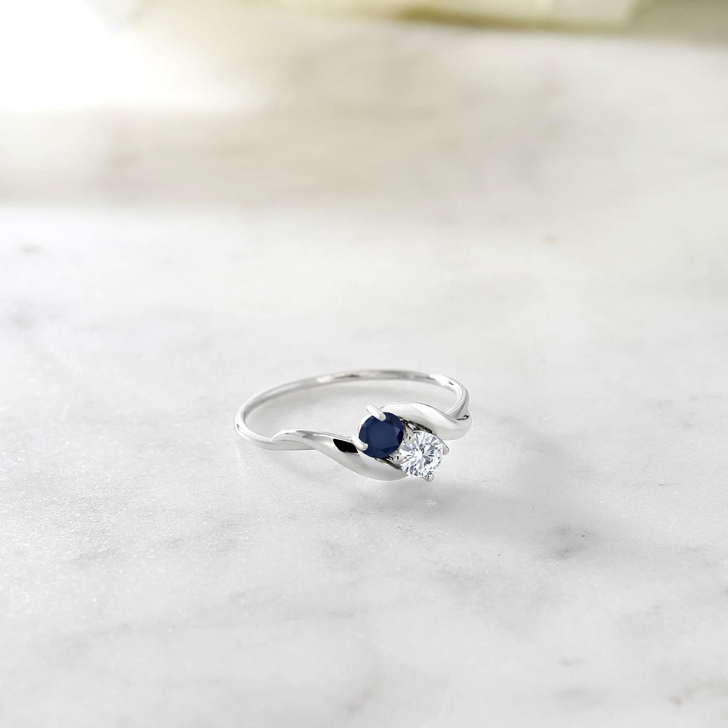 Gem Stone King 10K White Gold Round Blue Sapphire and White Moissanite Engagement Ring For Women (0.38 Cttw, Gemstone Birthstone, Available In Size 5, 6, 7, 8, 9)