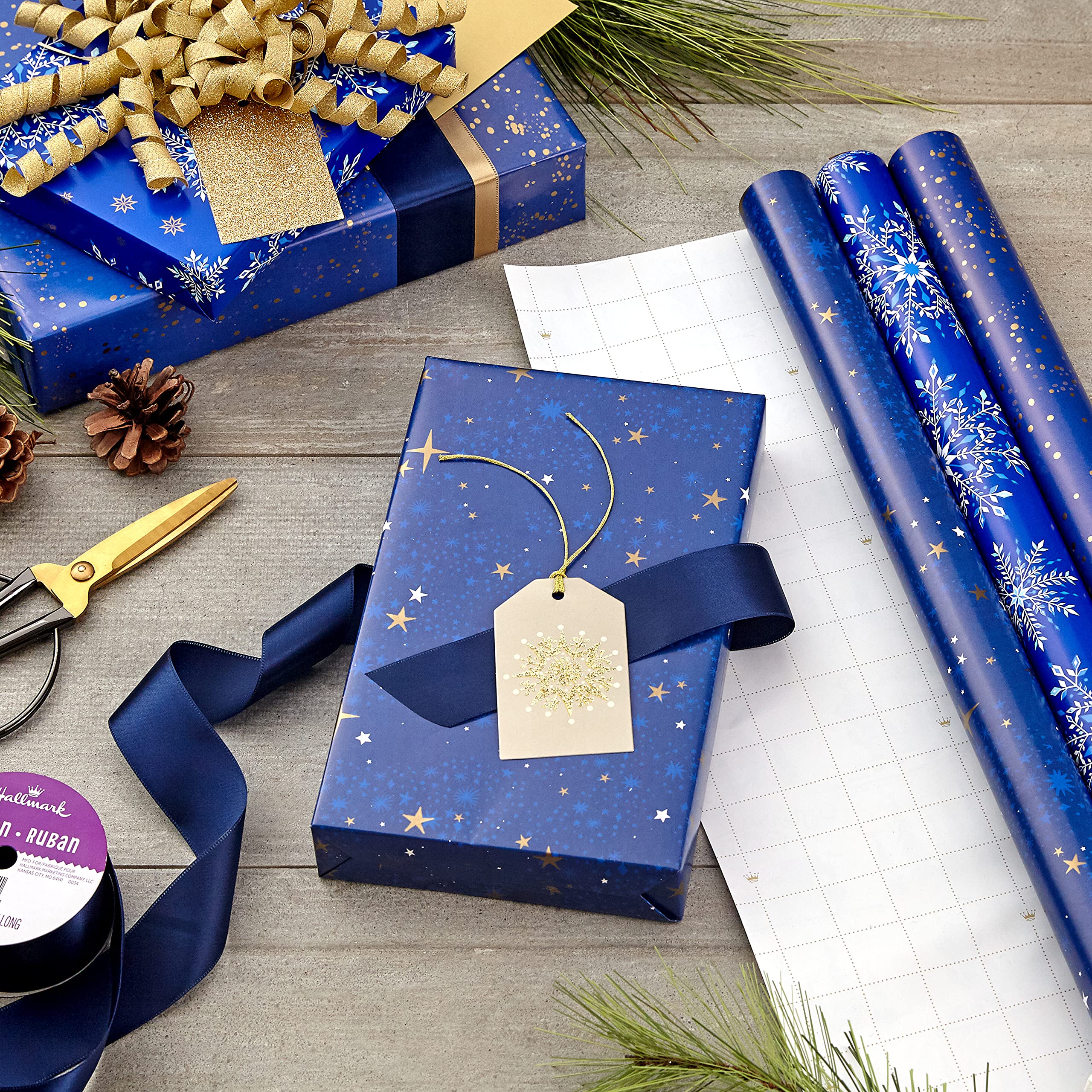 Hallmark Blue Wrapping Paper with Cut Lines on Reverse (3 Rolls: 120 sq. ft. ttl) Starry Snowflakes, Winter Galaxy, Navy Blue, Gold for Birthdays, Graduations, Winter Weddings