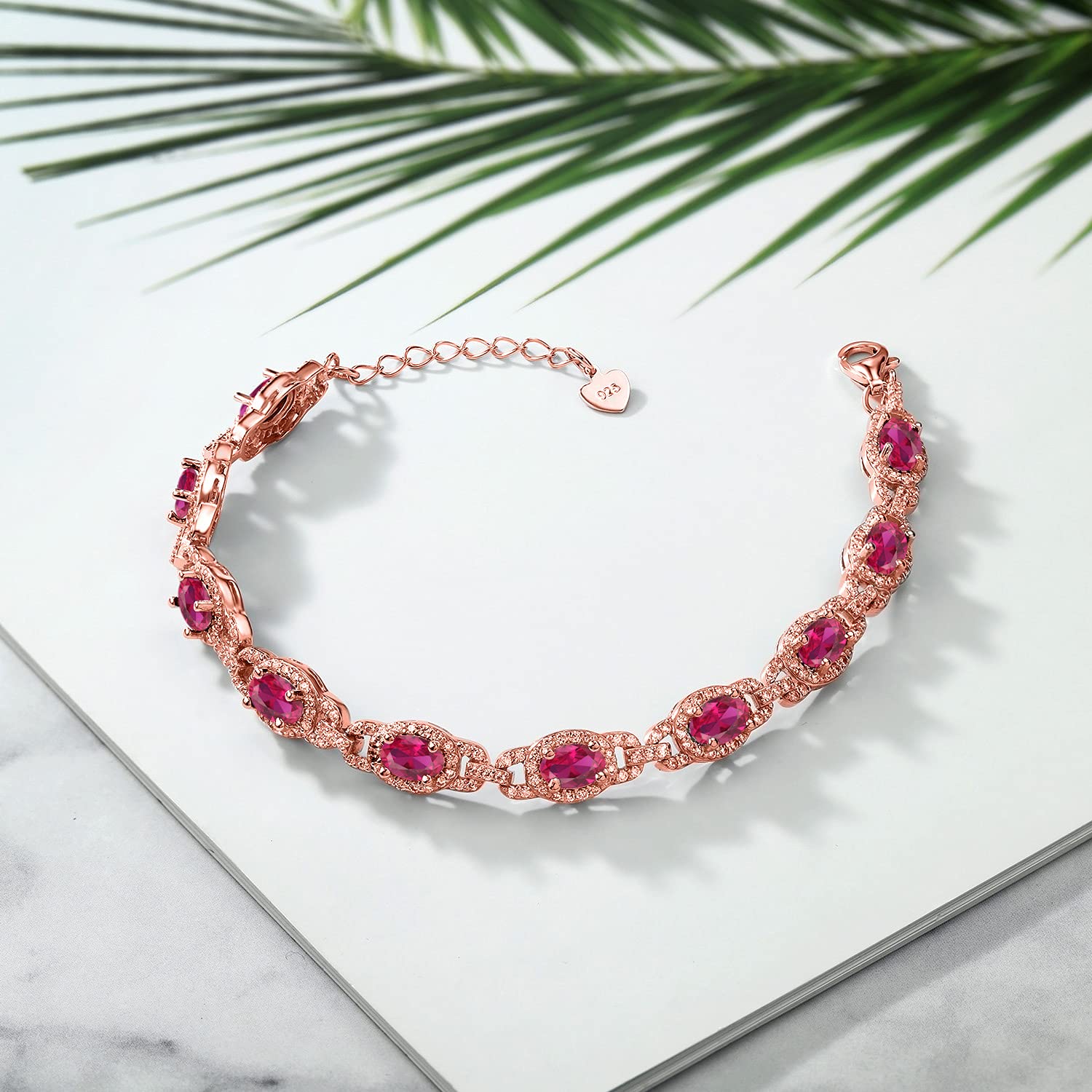 Gem Stone King 18K Rose Gold Plated Silver Red Created Ruby Tennis Bracelet For Women (14.60 Cttw, Oval 6X4MM, 7 Inch, With 1 Inch Extender)