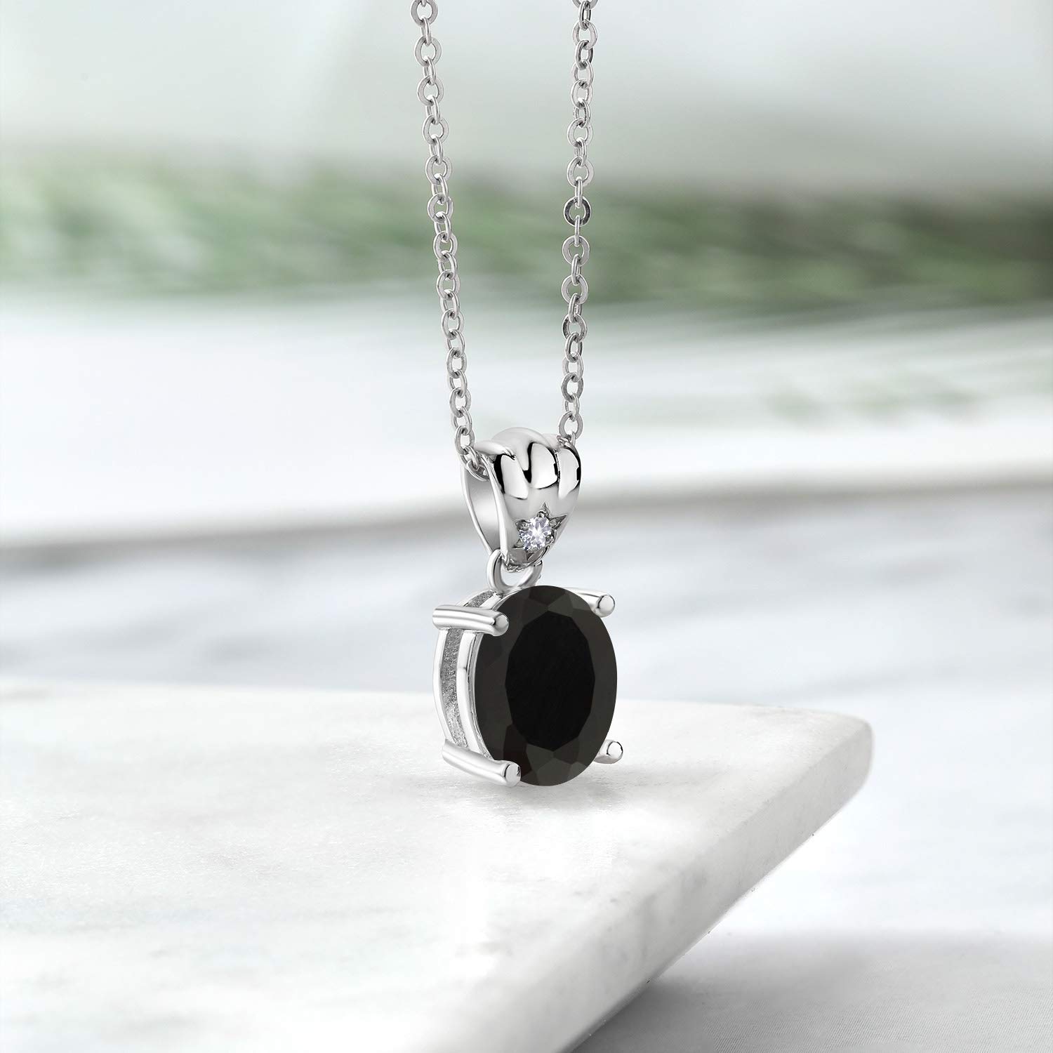 Gem Stone King 925 Sterling Silver Black Onyx and White Created Sapphire Pendant Necklace For Women (3.04 Cttw, Oval 11X9MM, with 18 Inch Silver Chain)
