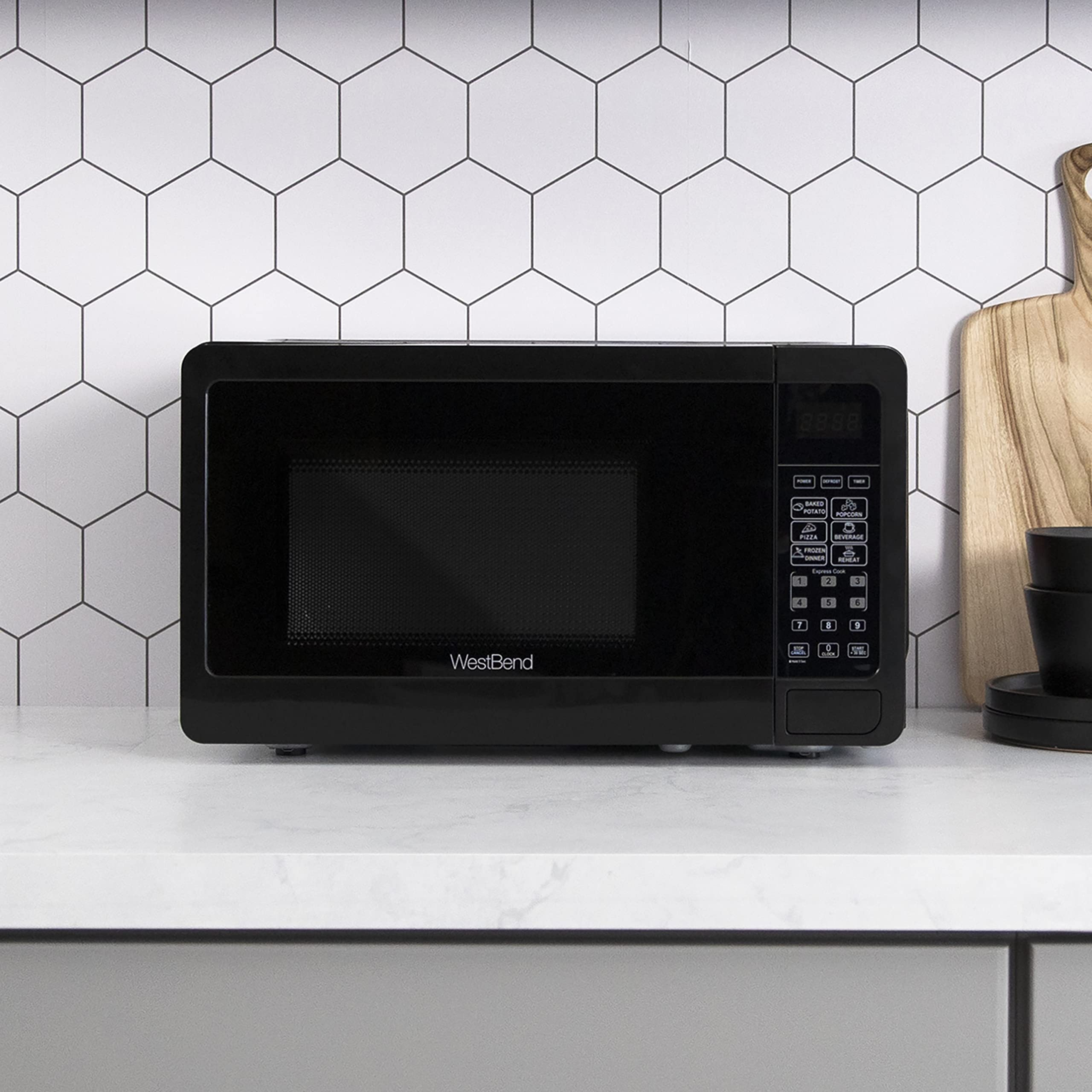West Bend WBMW71B Microwave Oven 700-Watts Compact with 6 Pre Cooking Settings, Speed Defrost, Electronic Control Panel and Glass Turntable, Black