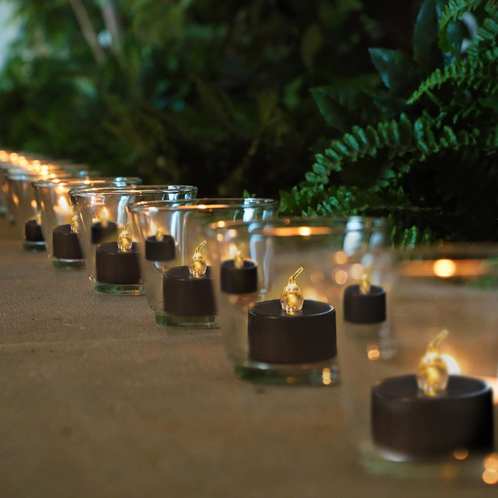 LANKER 24 Pack Black Tea Lights Candles β Flickering Warm Yellow Lights Flameless LED Candles β Long Lasting Battery Operated Fake Candles β Decoration for Wedding, Halloween and Christmas