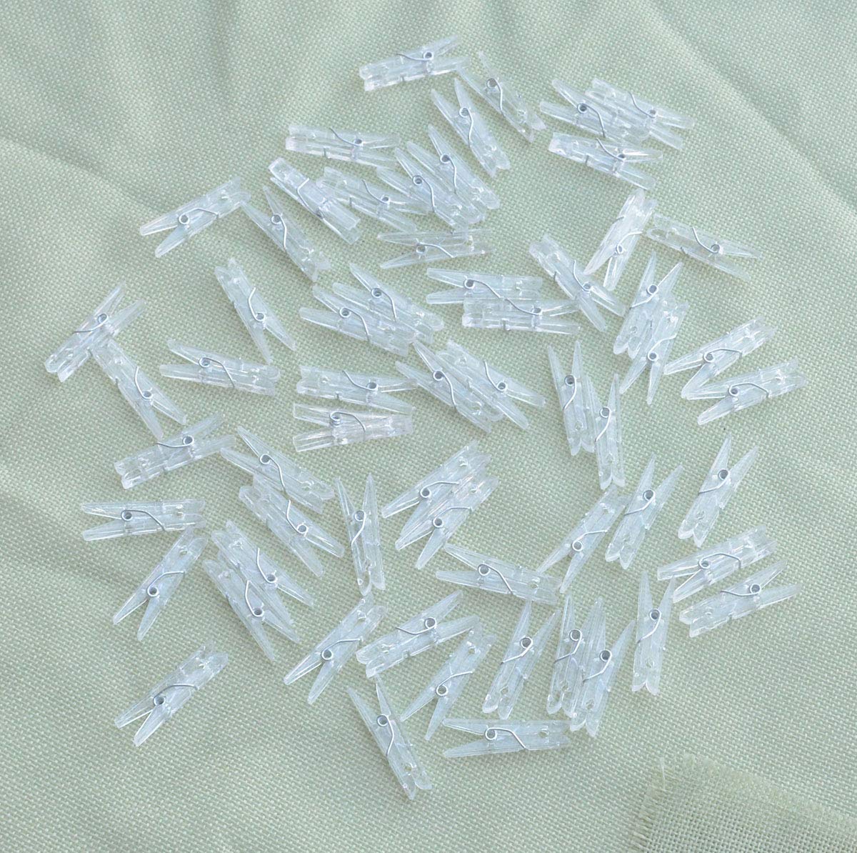 Yansanido 100pcs Mini Clear Plastic Utility Paper Clip, Clothespins Clips, Clothes Line String Clips, Mini Clothes Pins for Photo for String Fairy Lights Color Clear(100pcs Clear Plastic Clips)