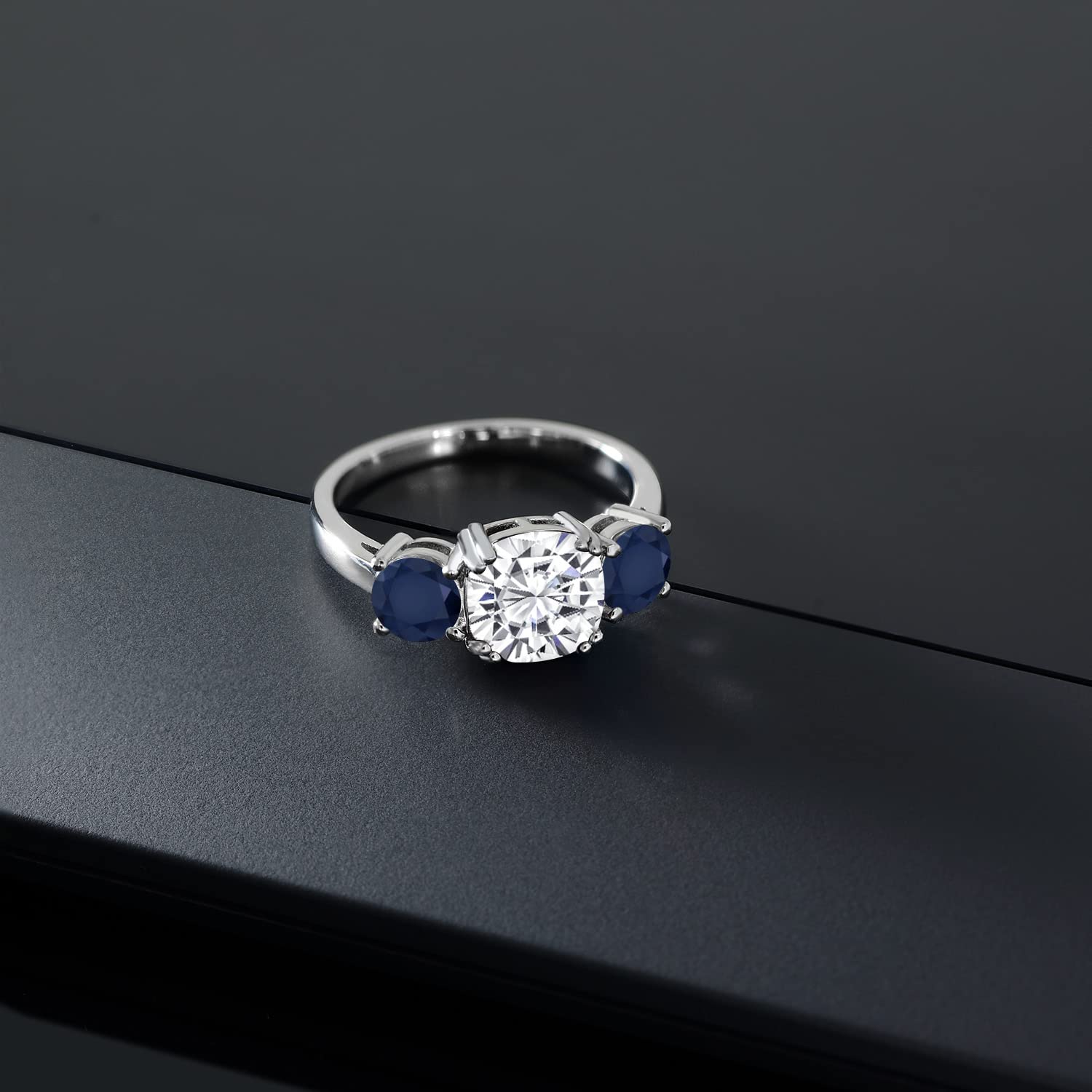 Gem Stone King 925 Sterling Silver White Moissanite and Blue Sapphire 3 Stone Engagement Ring For Women (3.60 Cttw, Gemstone, Cushion 8MM, Size 8)