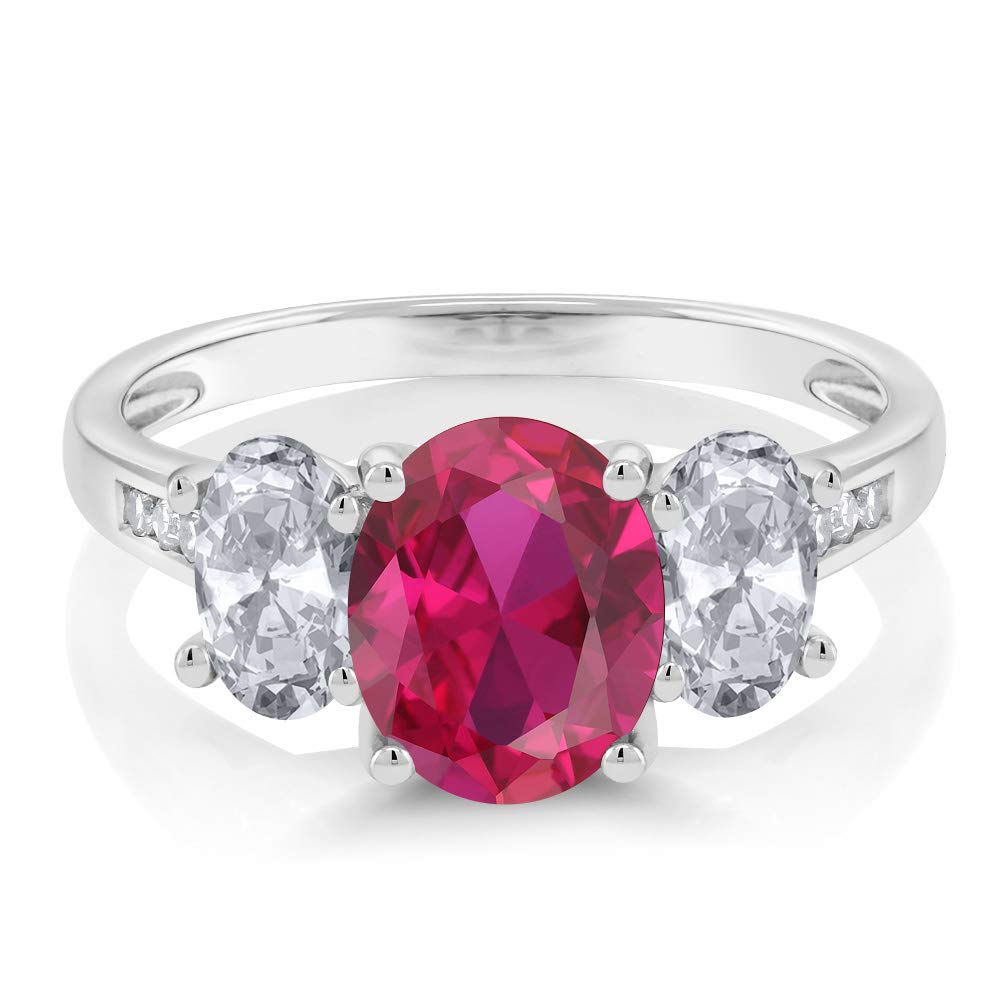 Gem Stone King 10K White Gold Red Created Ruby White Topaz and White Diamond Oval 3-Stone Engagement Ring For Women (2.15 Cttw, Gemstone July Birthstone, Available In Size 5, 6, 7, 8, 9)