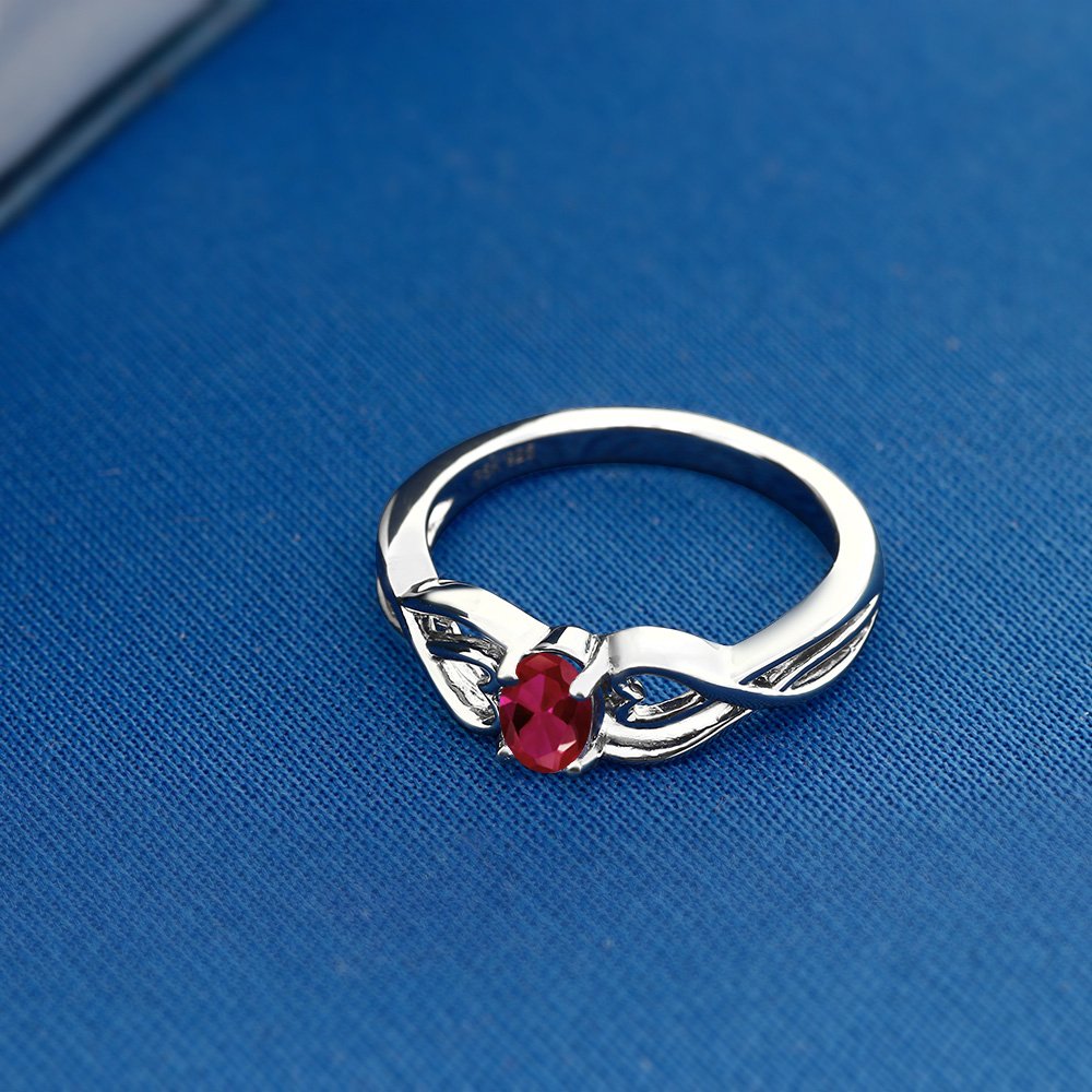 Gem Stone King 925 Sterling Silver Red Created Ruby Women Engagement Ring (0.50 Ct Oval) (Size 8)