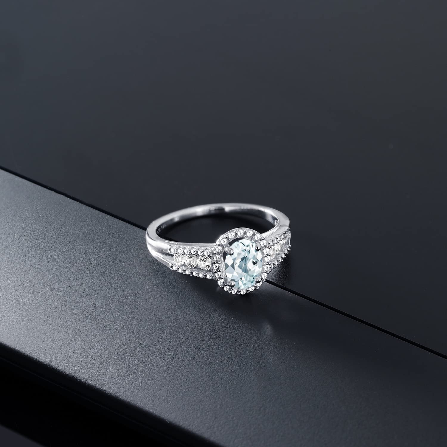 Gem Stone King 925 Sterling Silver Sky Blue Aquamarine and White Created Sapphire Women Engagement Ring (0.99 Cttw, Oval 7X5MM, Gemstone Birthstone, Available in size 5, 6, 7, 8, 9)