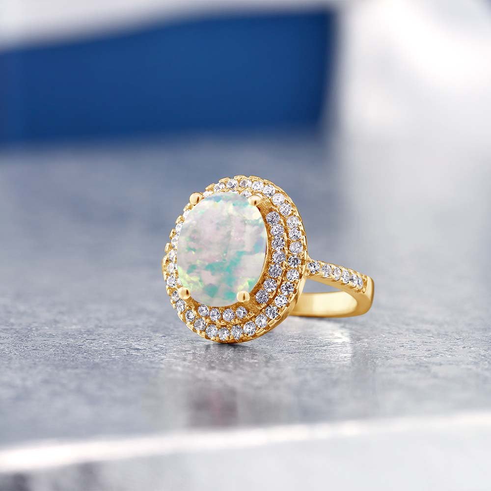 Gem Stone King 18K Yellow Gold Plated Silver Oval Cabochon White Simulated Opal Ring For Women (2.80 Cttw, Available In Size 5,6,7,8,9)