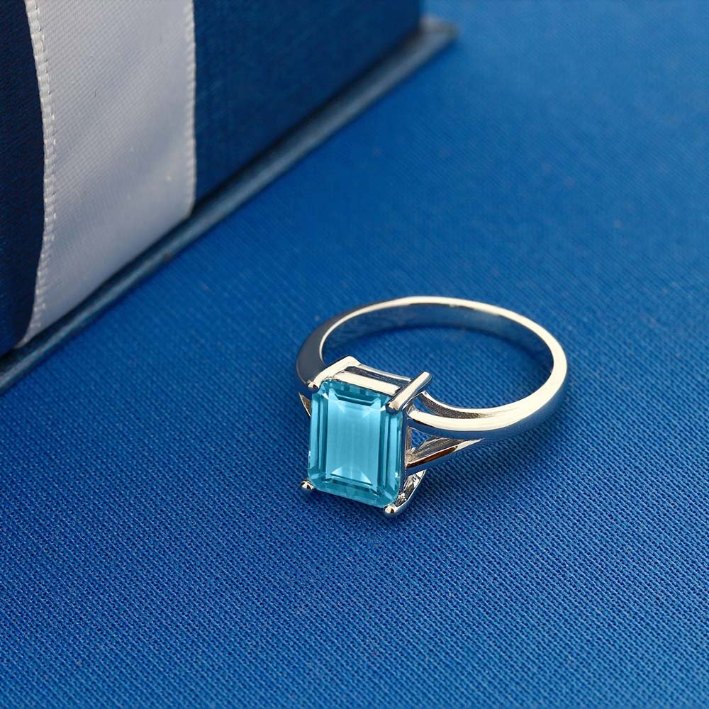 Gem Stone King 925 Sterling Silver Swiss Blue Topaz Solitaire Engagement Ring For Women (3.20 Cttw, Emerald Cut 9X7MM, Gemstone November Birthstone, Available in Size 5,6,7,8,9)