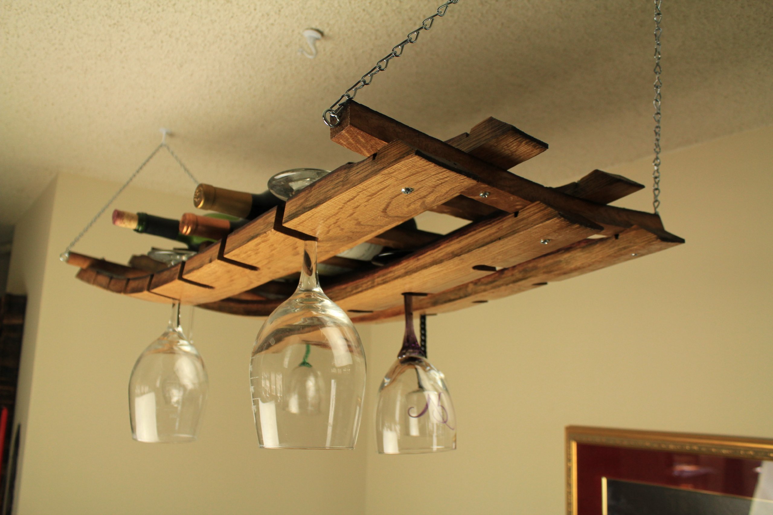 Hanging wine bottle and glass rack made from oak wine barrel staves