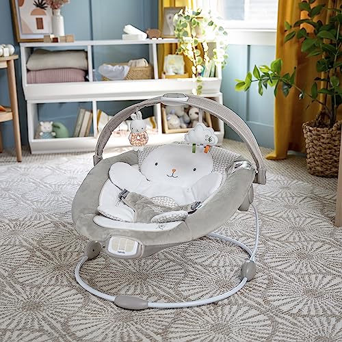 Ingenuity InLighten Baby Bouncer Infant Seat with Light Up -Toy Bar, Vibrations, Tummy Time Pillow & Sounds, 0-6 Months Up to 20 lbs (Twinkle Tails Bunny)