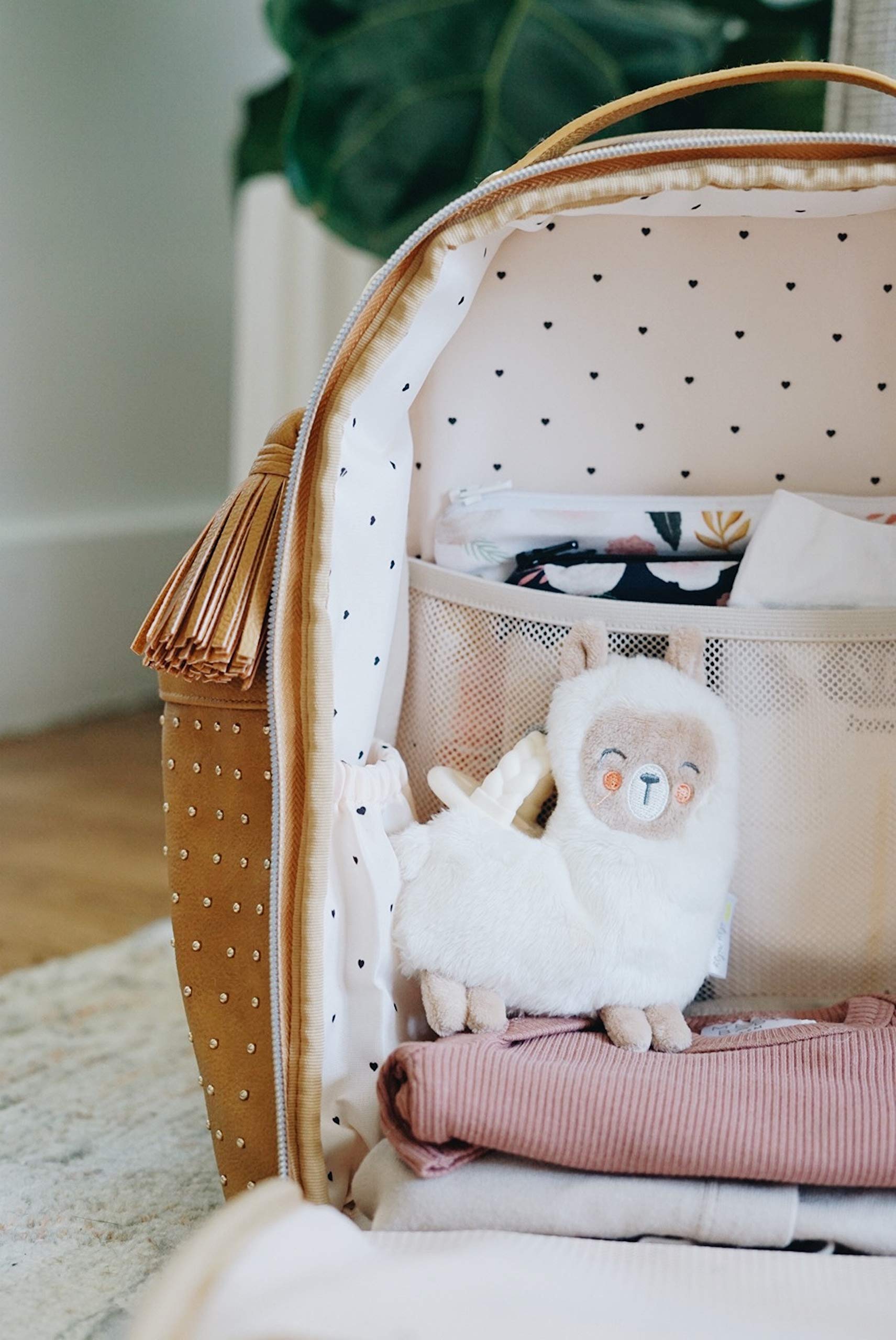 Itzy Ritzy Chelsea + Cole Mini Diaper Bag Backpack - Studded Mini Backpack with Changing Pad, 8 Pockets, Rubber Feet & Tassel - Caramel with Sweetheart Print Interior and Gold Hardware