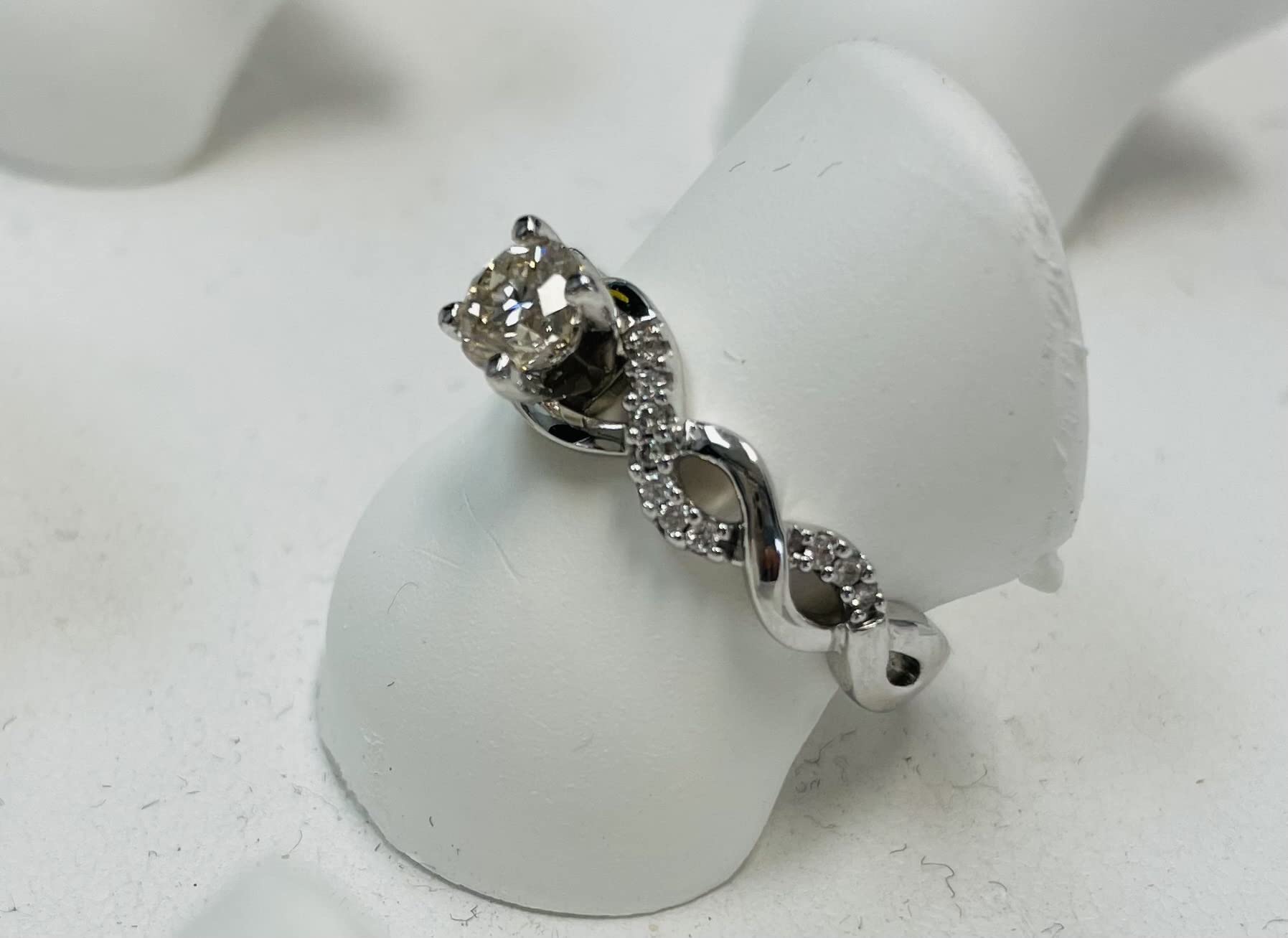 Houston Diamond District 0.63 Carat Twisting Infinity Gold and Diamond Split Shank Pave Set Diamond Engagement Ring 14K White Gold with a 0.5 Carat J-K I2 Round Brilliant Cut/Shape Center