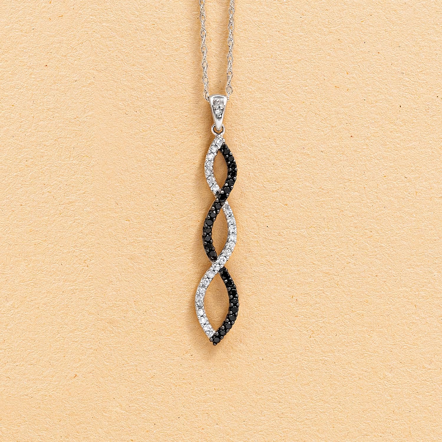 Jewelili 10k White Gold Twist Pendant Necklace with Round Black and White Diamonds, 1/4 cttw, 18" Rope Chain