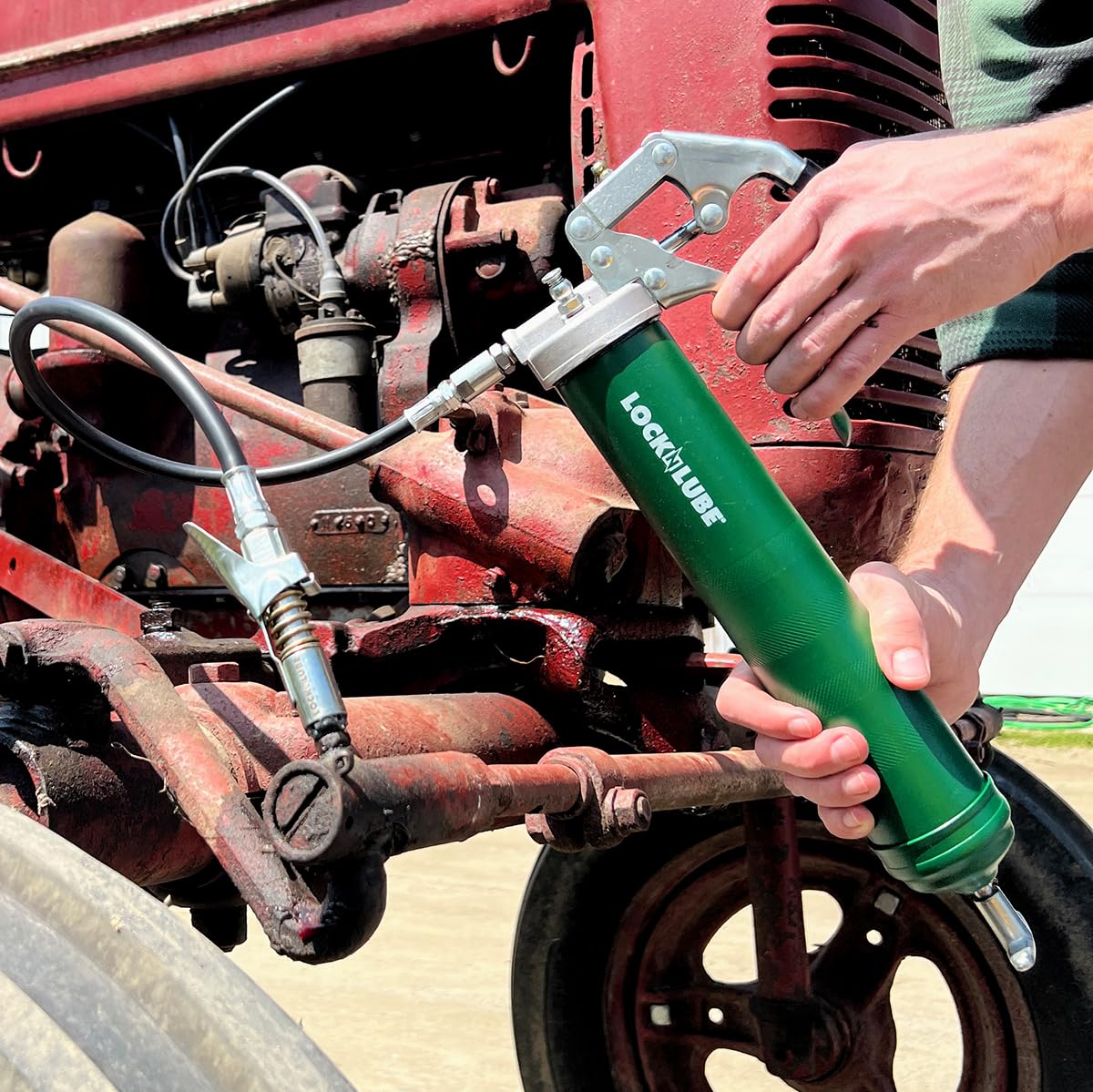 LockNLube Heavy-Duty Pistol Grip Grease Gun. Includes our patented LockNLubeĀ® Grease Coupler (Locks On, Stays On, Won't Leak!) plus a high-quality 20" hose and in-line hose swivel