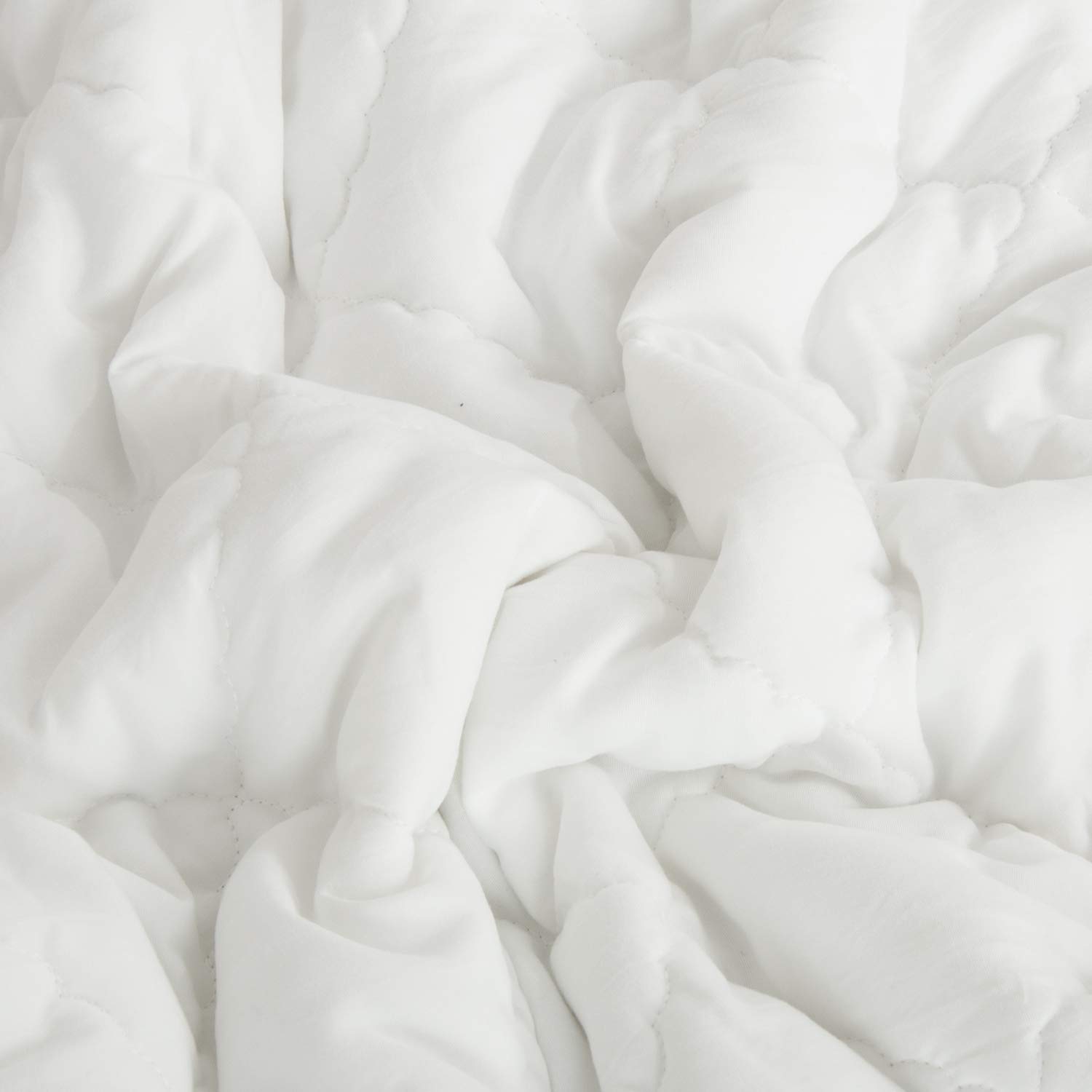 NTBAY Down Alternative Toddler Comforter, Lightweight and Warm Solid Color Baby Crib Quilted Blanket, 39x47 inches, White