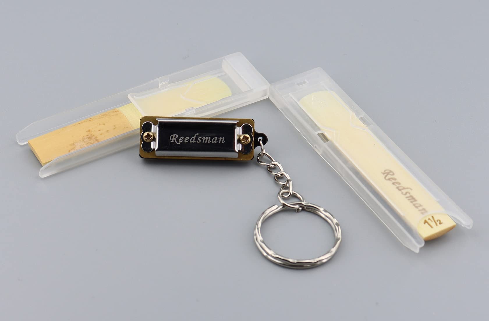 Reedsman Traditional Bb Clarinet Reeds, Includes 10 Plus 2 Total 12 Pack Reeds With Individual Reed Holders and One Mini Harmonica. (Strength 1.5)