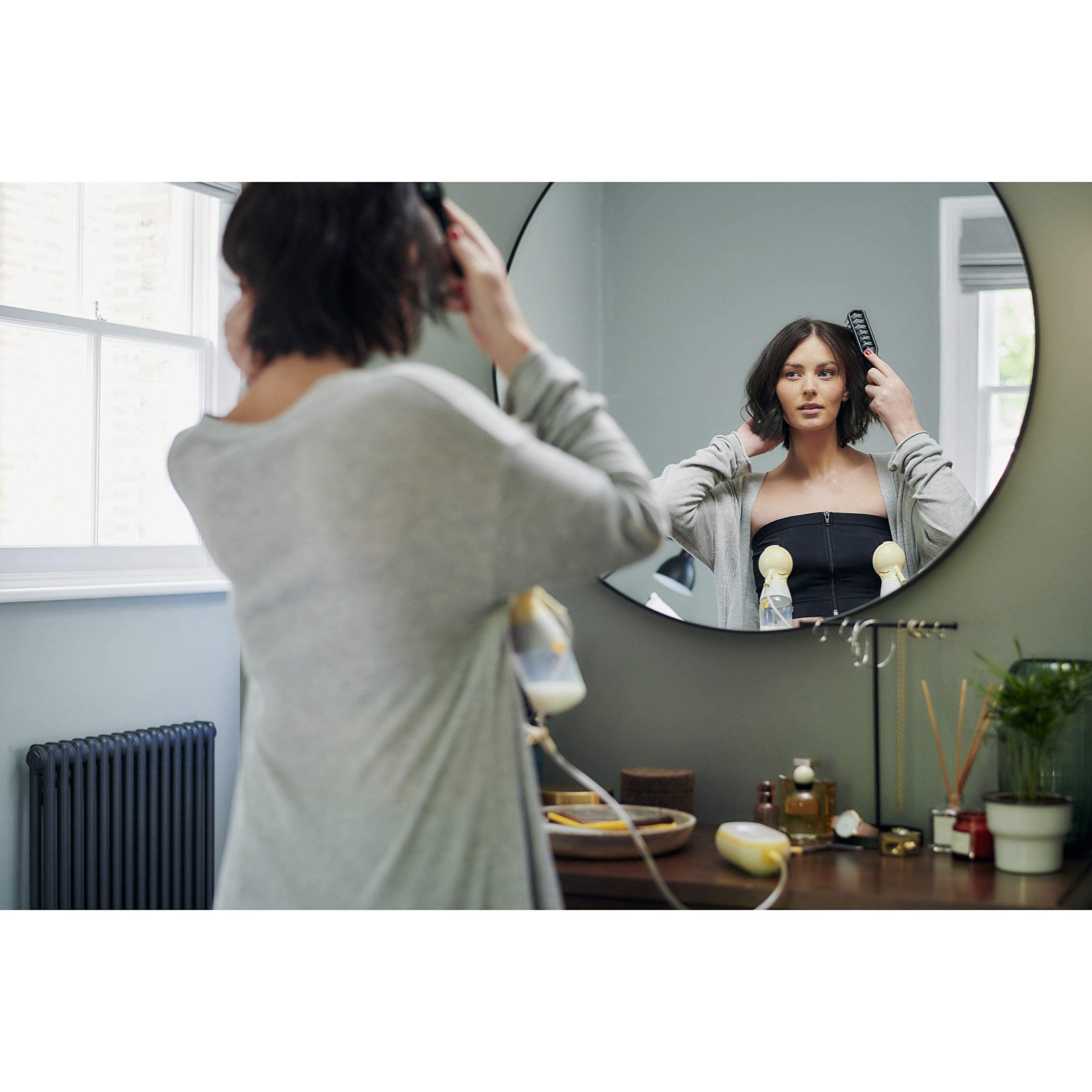 Medela Freestyle Flex Breast Pump with Bonus 100 Breast Milk Storage Bags, Closed System Quiet Handheld Portable Double Electric Breastpump, Mobile Connected Smart Pump with Touch Screen LED Display