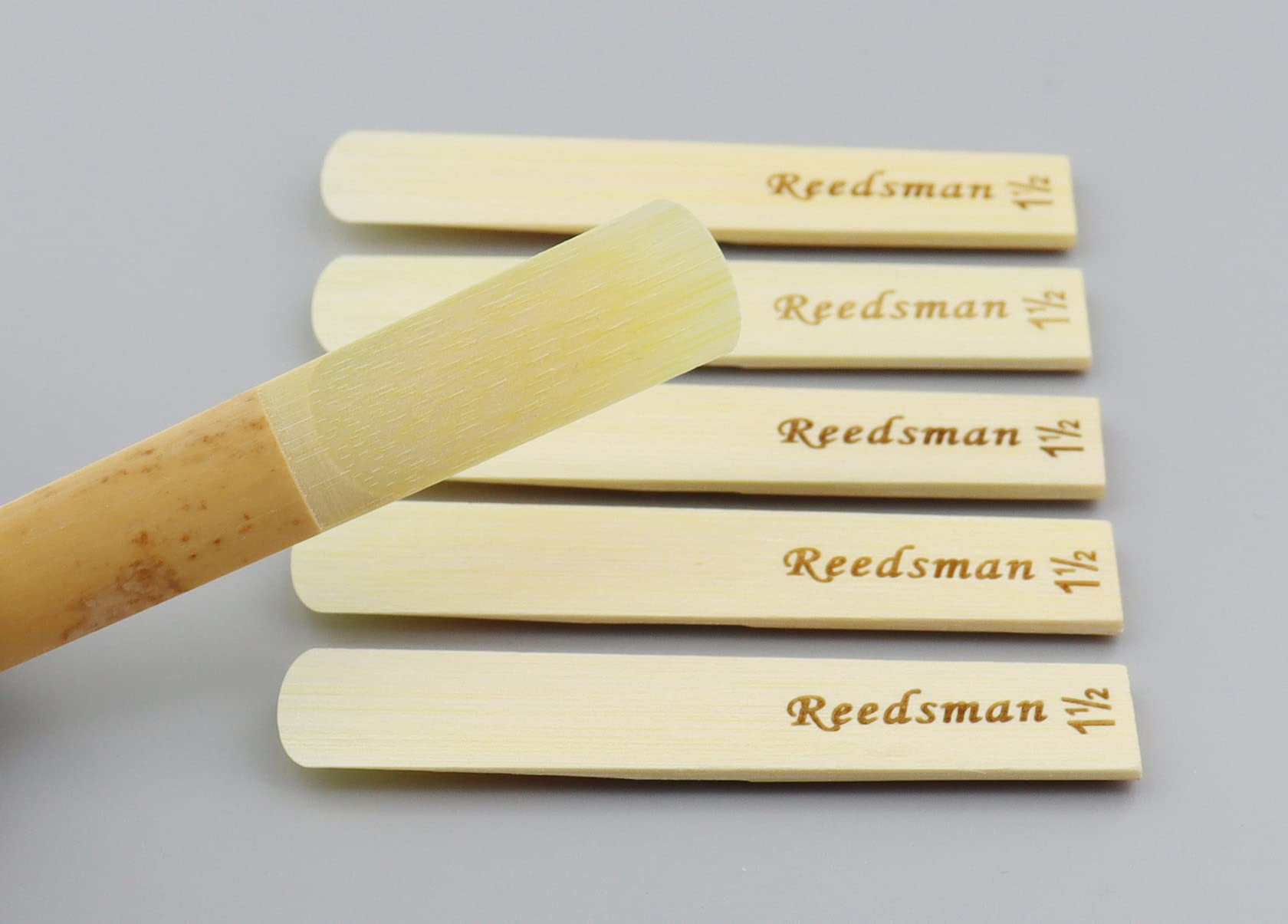 Reedsman Traditional Bb Clarinet Reeds, Includes 10 Plus 2 Total 12 Pack Reeds With Individual Reed Holders and One Mini Harmonica. (Strength 1.5)