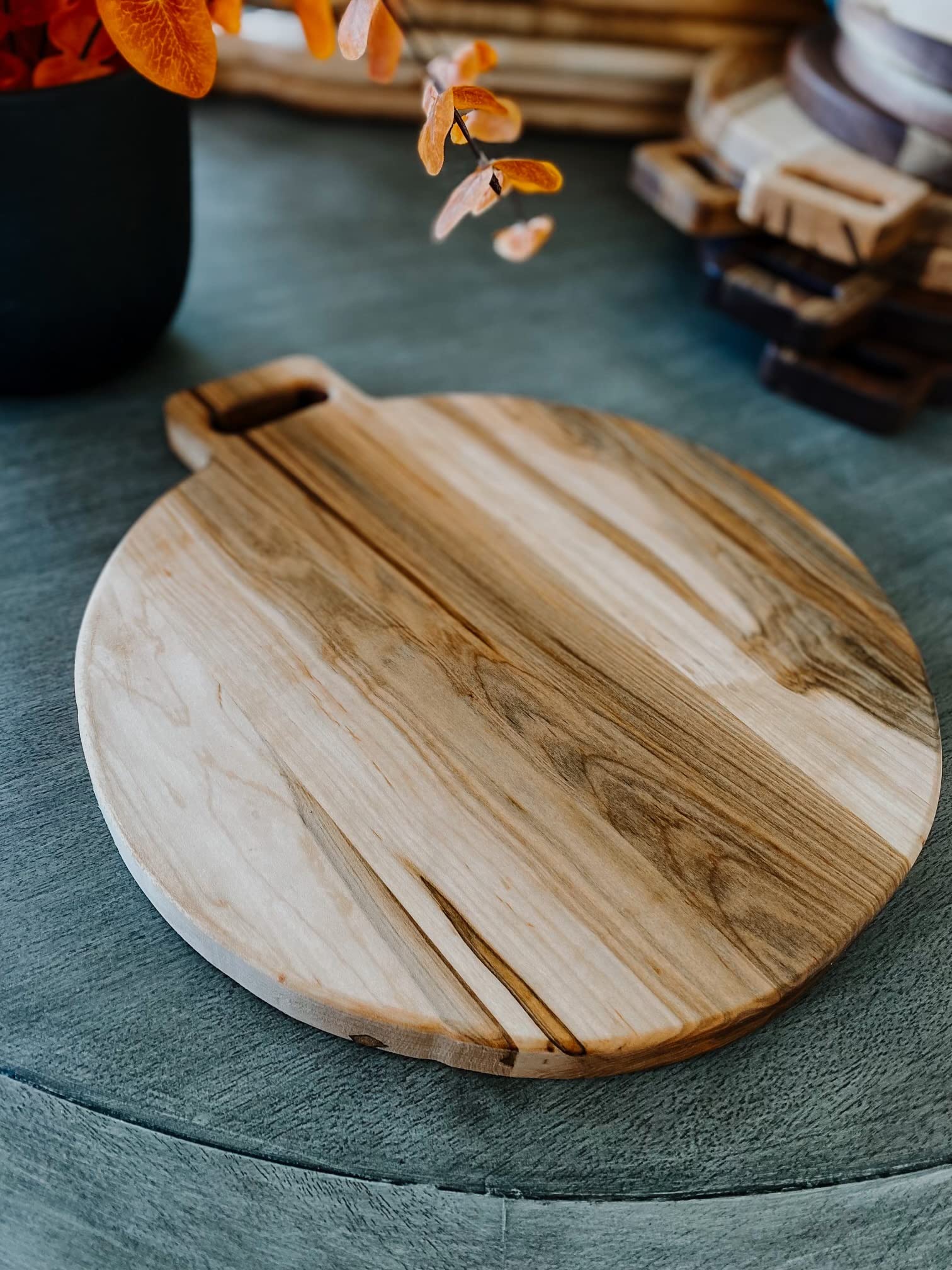Round charcuterie serving board with handle, handmade in the USA with Maple hardwood.