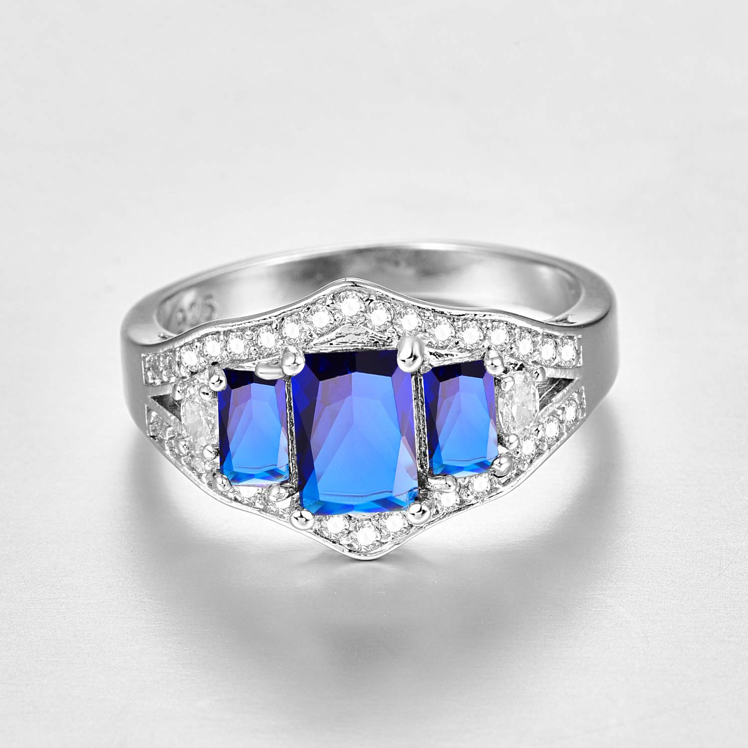 Narica Silver Plated 3-Stone Emerald Cut Created Blue Sapphire Cubic Zirconia Filled Halo Wedding Engagement Band Elegant Women's Ring for Mom Bridal Lover 7#