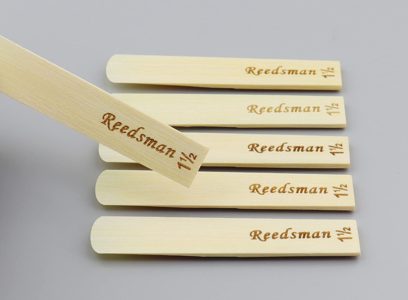 Reedsman Traditional Bb Clarinet Reeds, Includes 10 Plus 2 Total 12 Pack Reeds With Individual Reed Holders and One Mini Harmonica. (Strength 1.5)