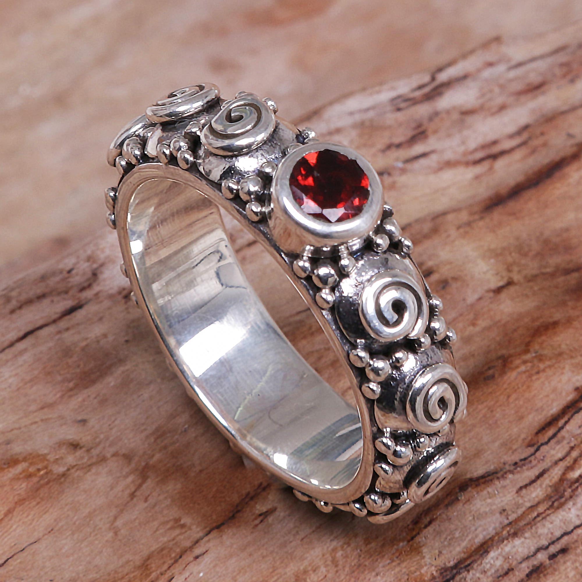 NOVICA Artisan Handmade Garnet Singlestone Ring Sterling Silver from Indonesia Red Birthstone [crownbezel 0.2 in H x 0.2 in Diam. Band Width 6 mm W] ' Swirls of Joy in Red'