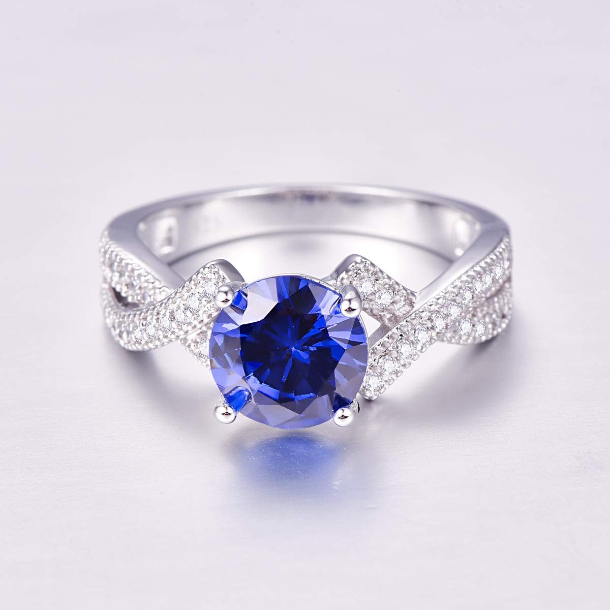 Momius 925 Sterling Silver 4-Prong Created Sapphire Quartz Brilliant Round Cut CZ Split Shank Twist Wedding Band Engagement Ring for Women Size 8