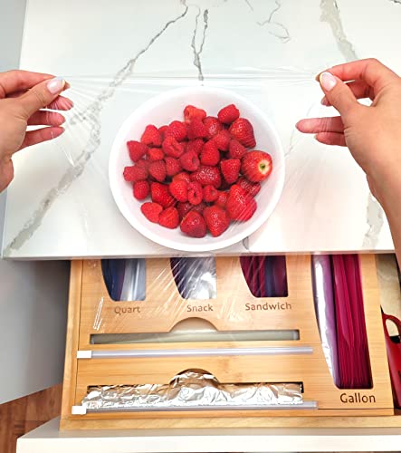 Redesigned and OVERSIZED ZipLock Bag storage organizer with plastic wrap and aluminum foil dispenser with cutter. 4 slots - Quart, Sandwich, Freezer and Gallon size.