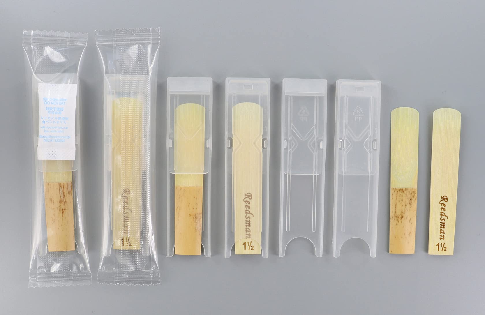 Reedsman Traditional Bb Clarinet Reeds, Includes 10 Plus 2 Total 12 Pack Reeds With Individual Reed Holders and One Mini Harmonica. (Strength 1.5)