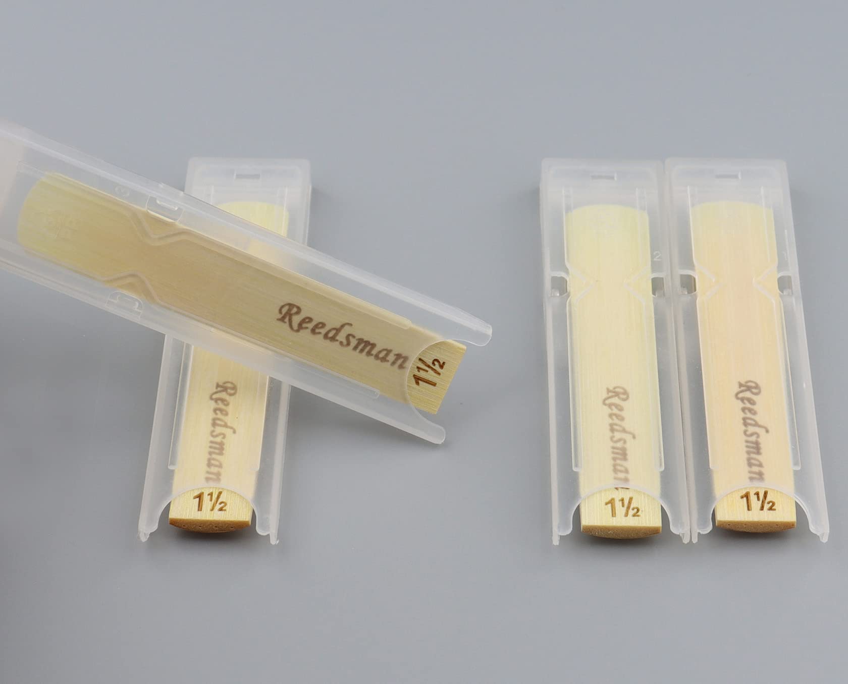 Reedsman Traditional Bb Clarinet Reeds, Includes 10 Plus 2 Total 12 Pack Reeds With Individual Reed Holders and One Mini Harmonica. (Strength 1.5)