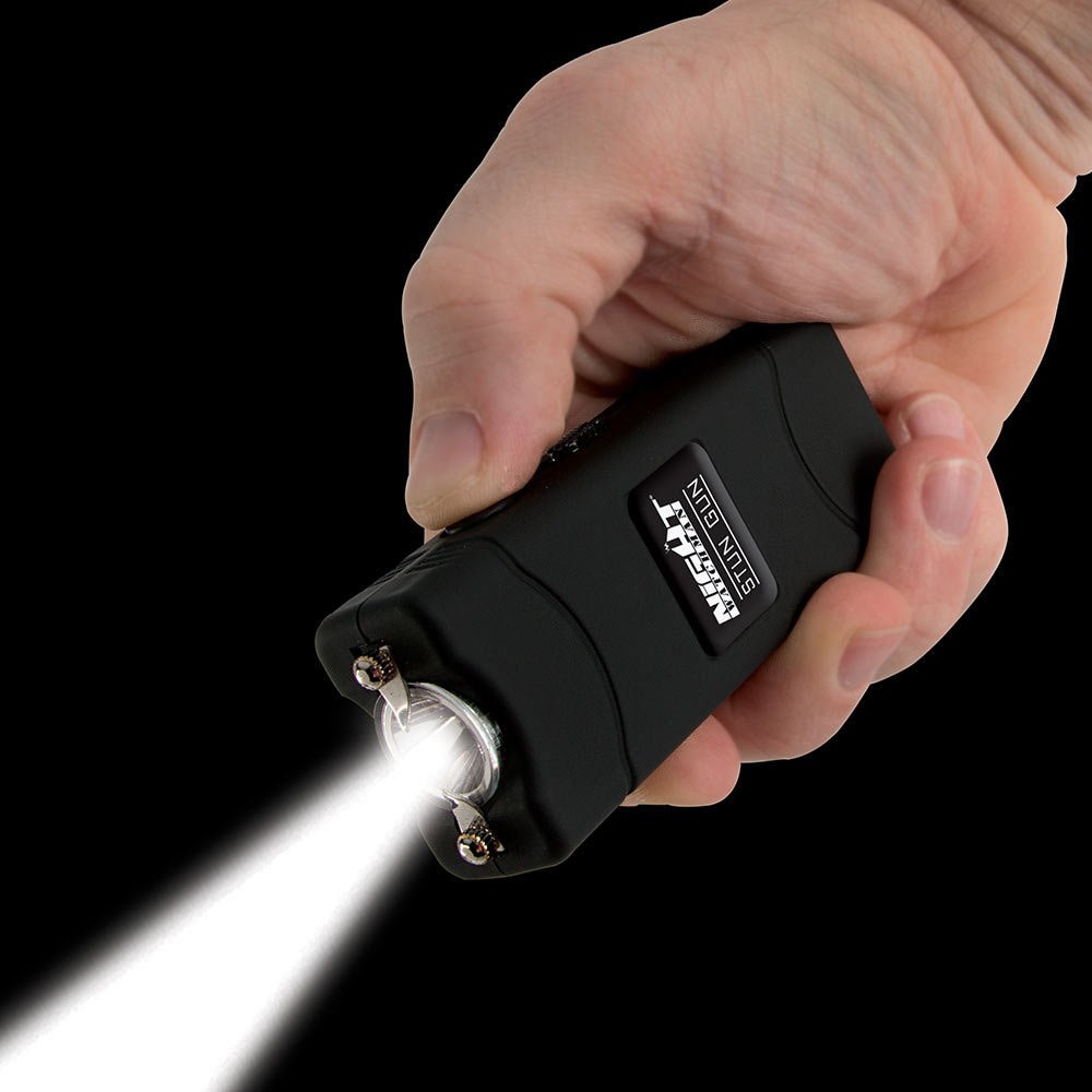 NIGHT WATCHMAN 5 Million-Volt Stun Gun and Built-in LED Flashlight with Nylon Belt Holster - Compact, Plugs Directly Into Wall for Recharge, for Personal Self-Defense - Dimensions 3 1/2"x 1"