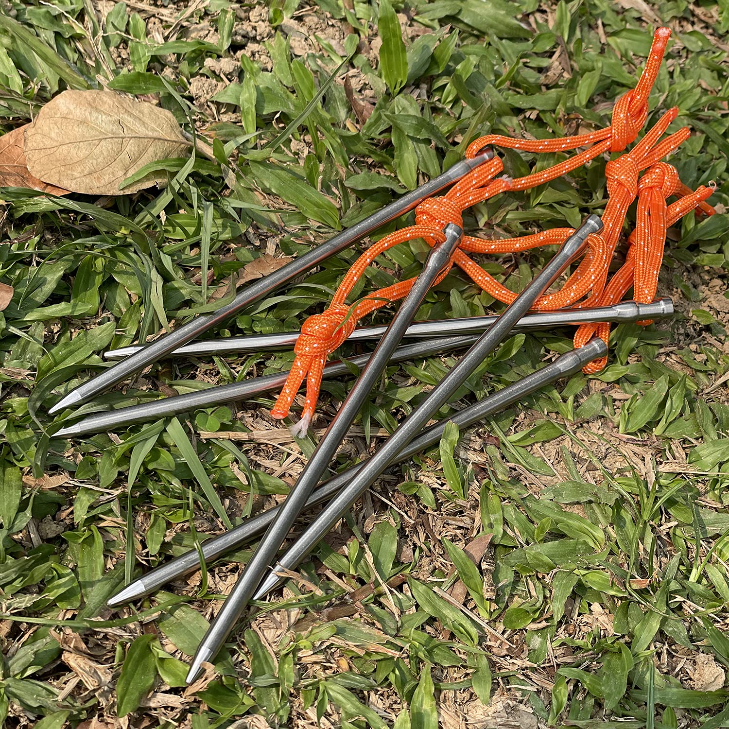 Tentock 6pcs Titanium Alloy Tent Stakes Durable Ultralight Camping Tent Pegs Windproof Tent Nails Spikes with Reflective Drawstring for Outdoor Camping Backpacking Hiking (TT0144(16.5CM))
