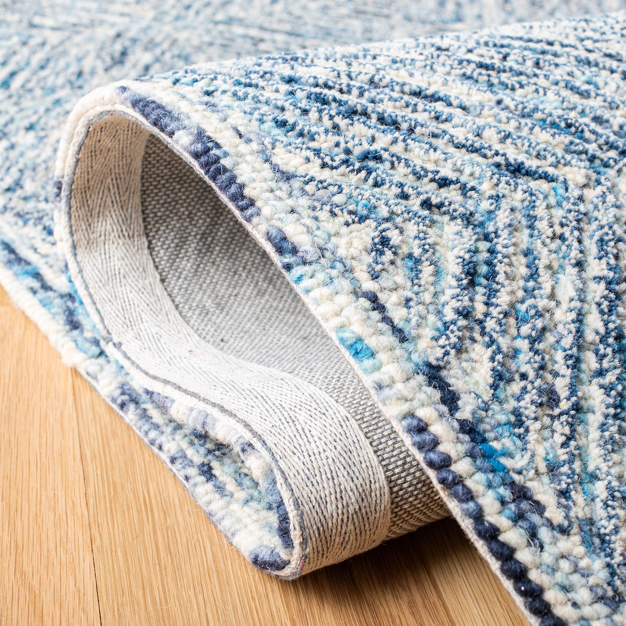 SAFAVIEH Capri Collection Area Rug - 9' x 12', Ivory & Blue, Handmade Wool, Ideal for High Traffic Areas in Living Room, Bedroom (CPR207A)