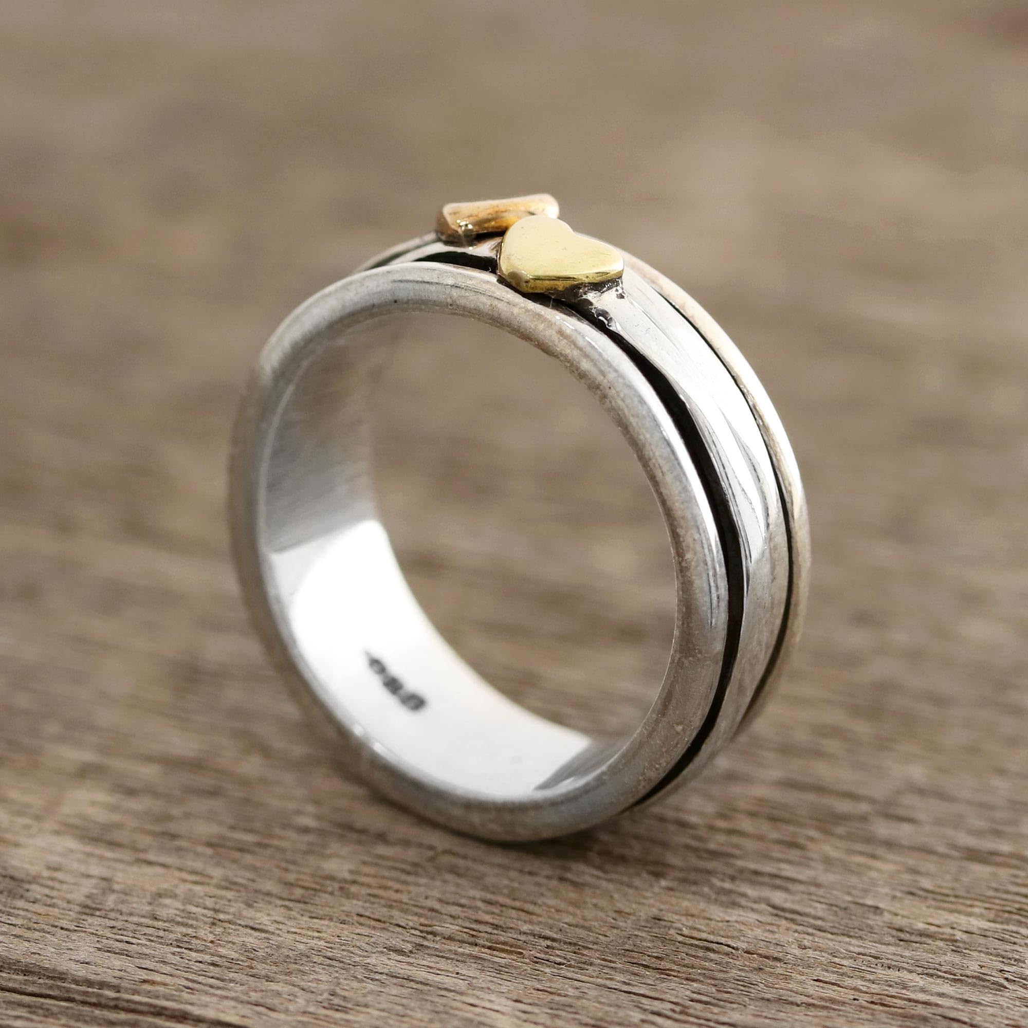 NOVICA Artisan handmade sterling silver spinner ring heart motif brass no stone band meditation india [Band width 6 mm W] ' traveling hearts'